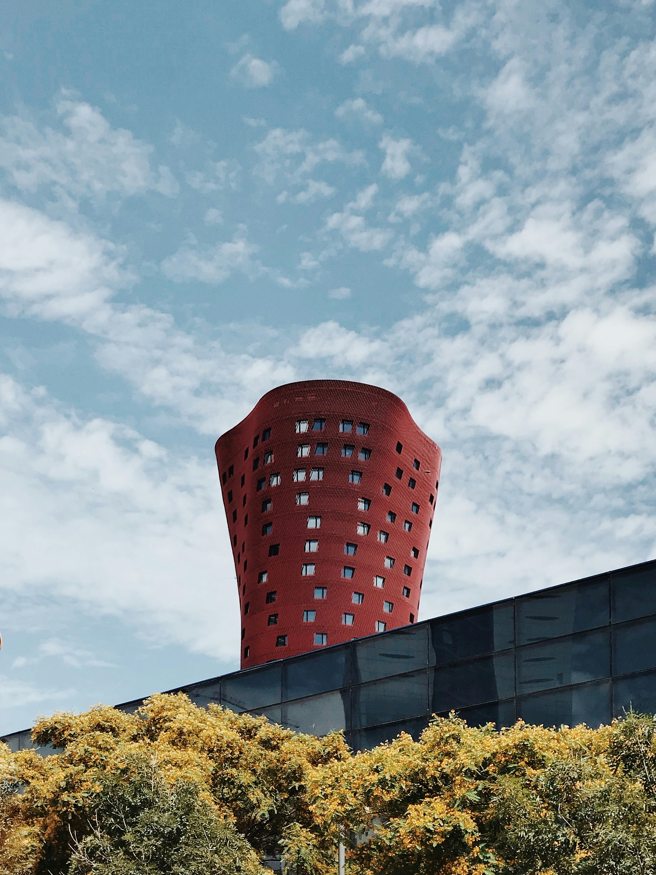 Red architectural building under cloudy sky photo – Free Испания Image ...