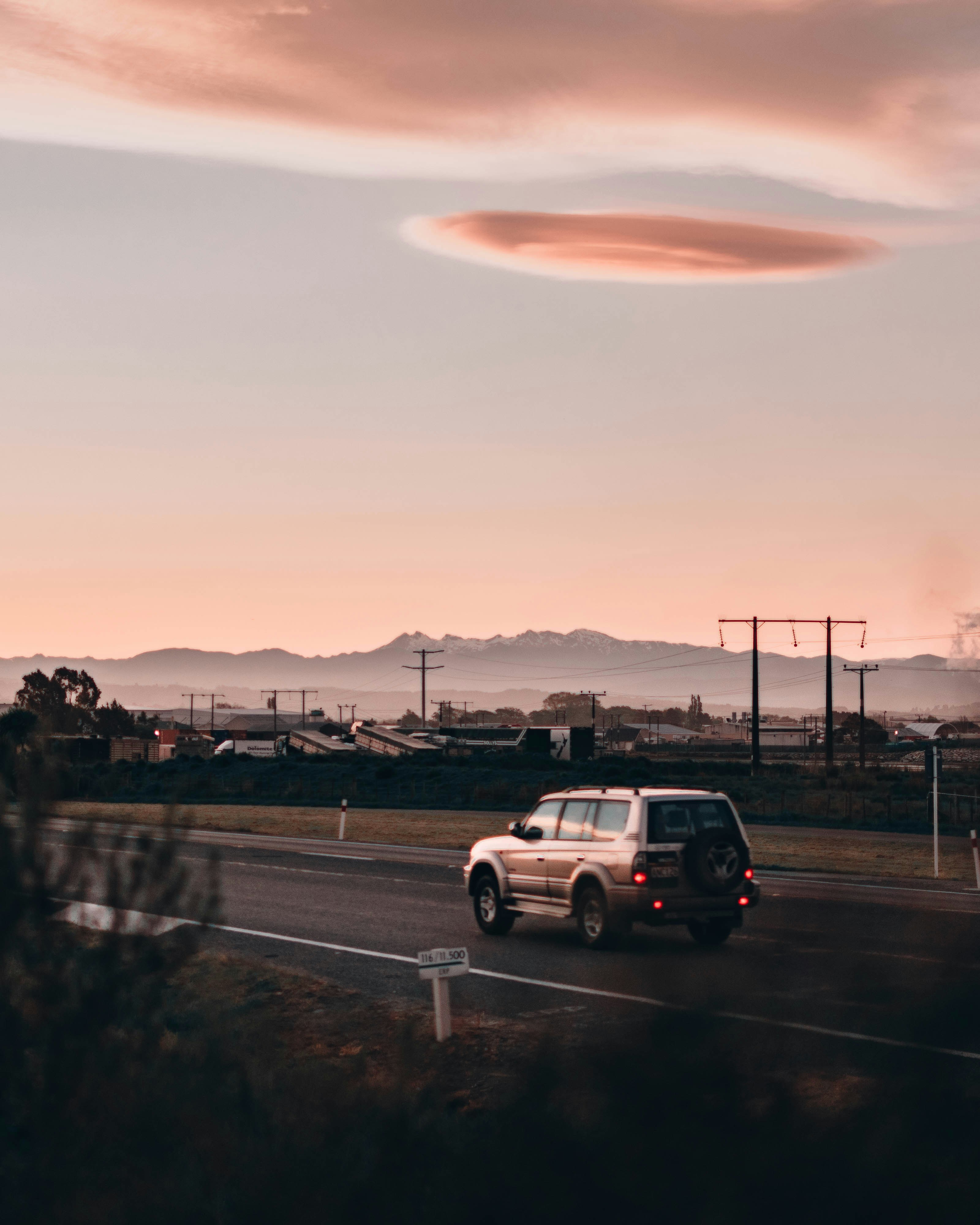 Twilight Highway: SUV on a Quiet Sunset Route