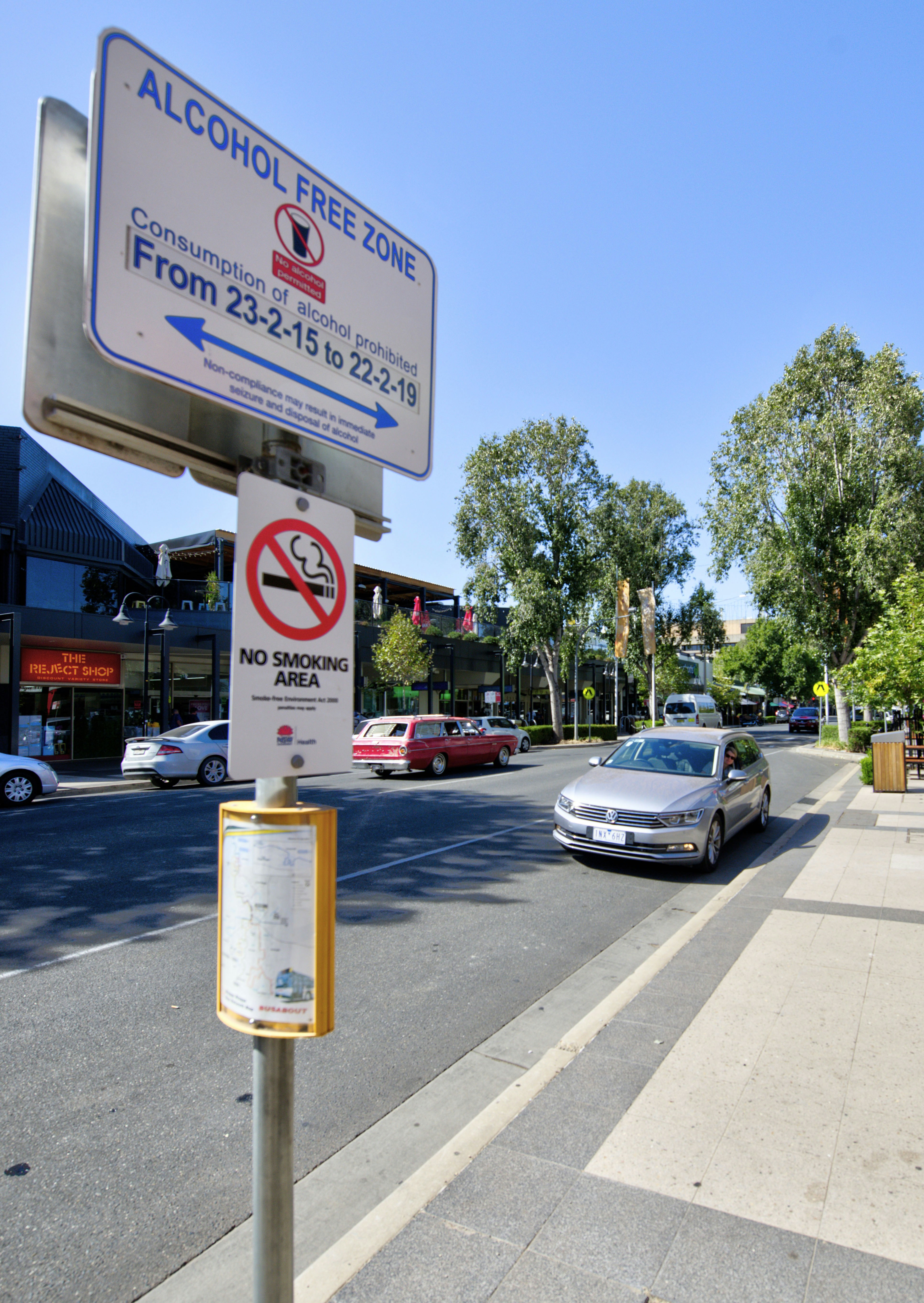 Street Corner Signage and Carriageway in a Sunlit Town