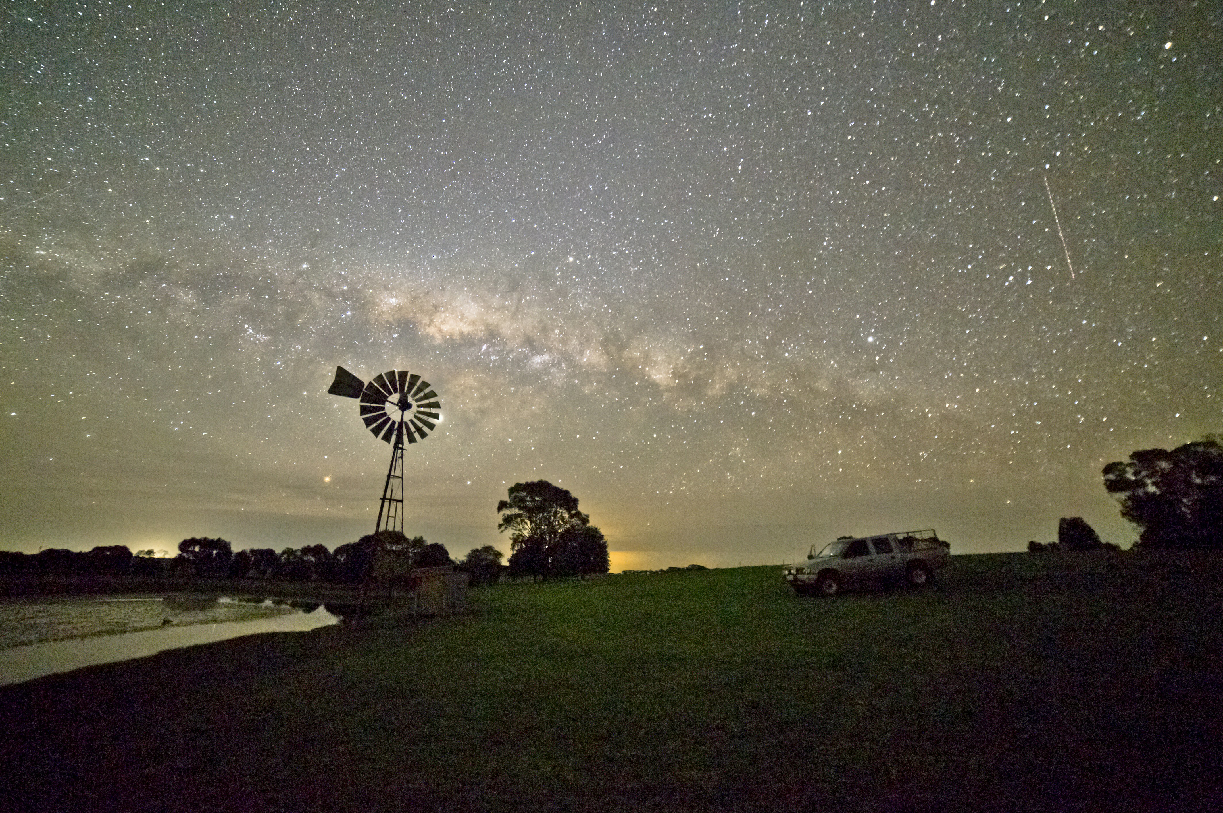 Wind vane and car on grassy field photo – Free Car Image on Unsplash