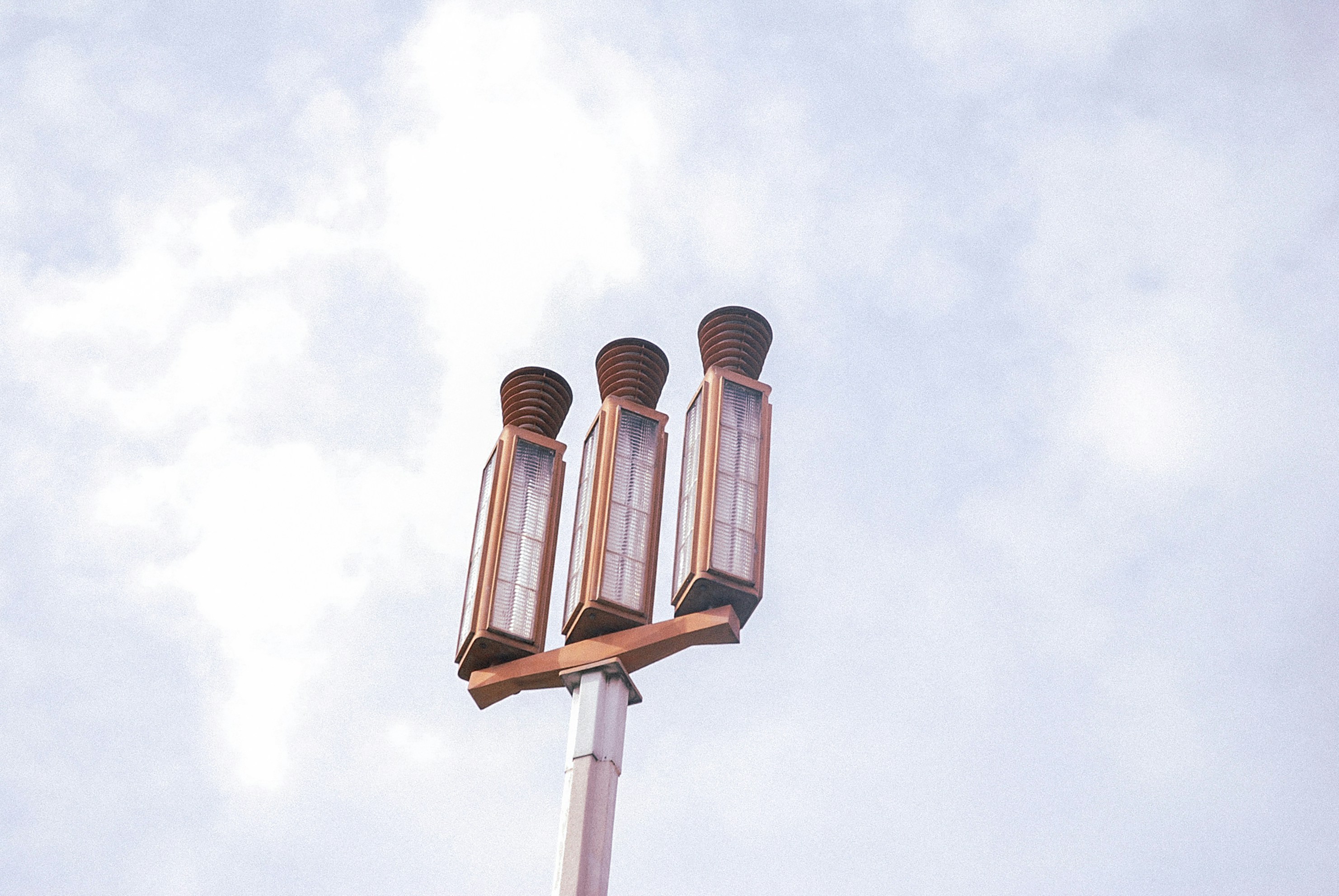 Tri-Lantern Stand: A Minimalist Street Light Against a Quiet Sky