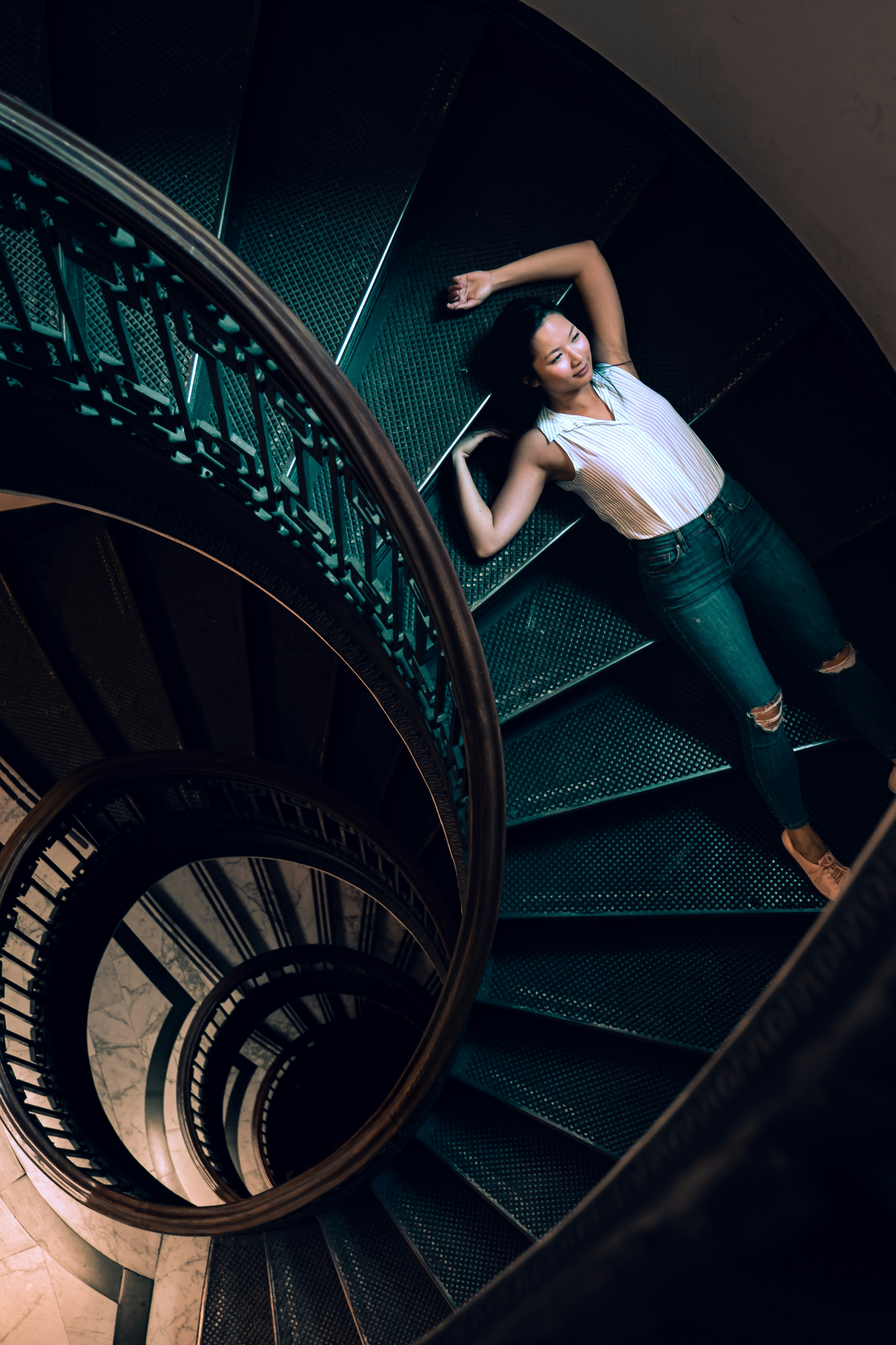 Spiral Staircase Reverie: A Portrait on Metal Rungs