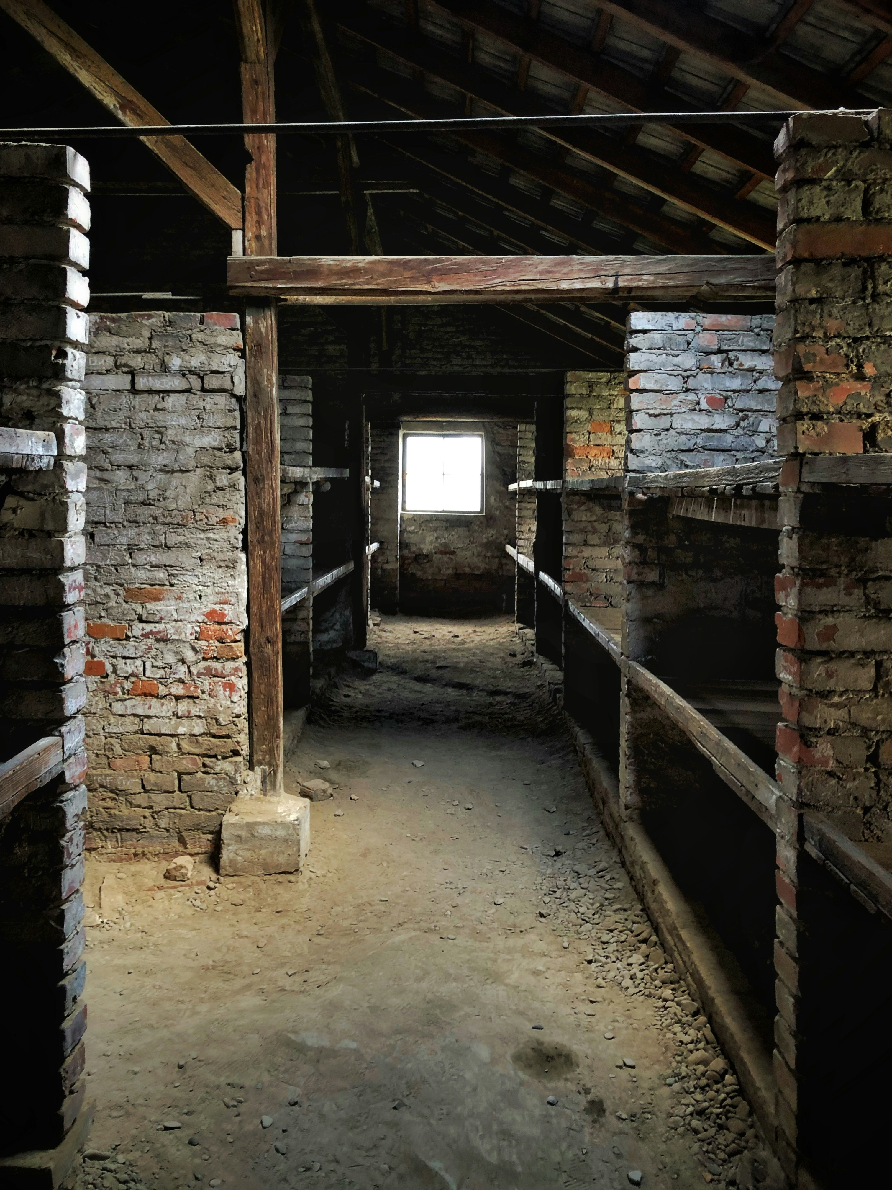 Windowed Beacon at the End of a Bricked Stable Corridor