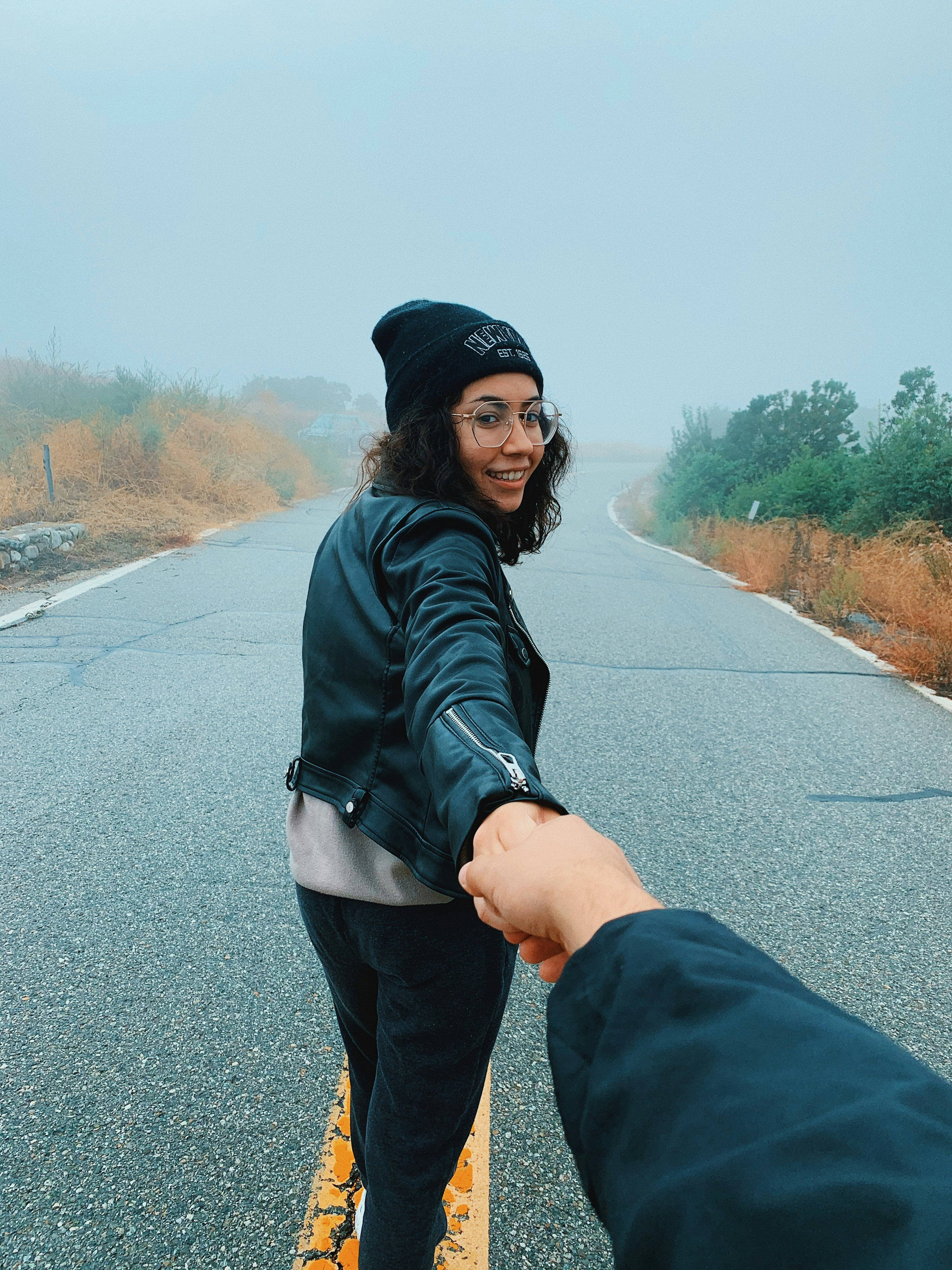 Grasping the Horizon: A fog-draped roadside moment