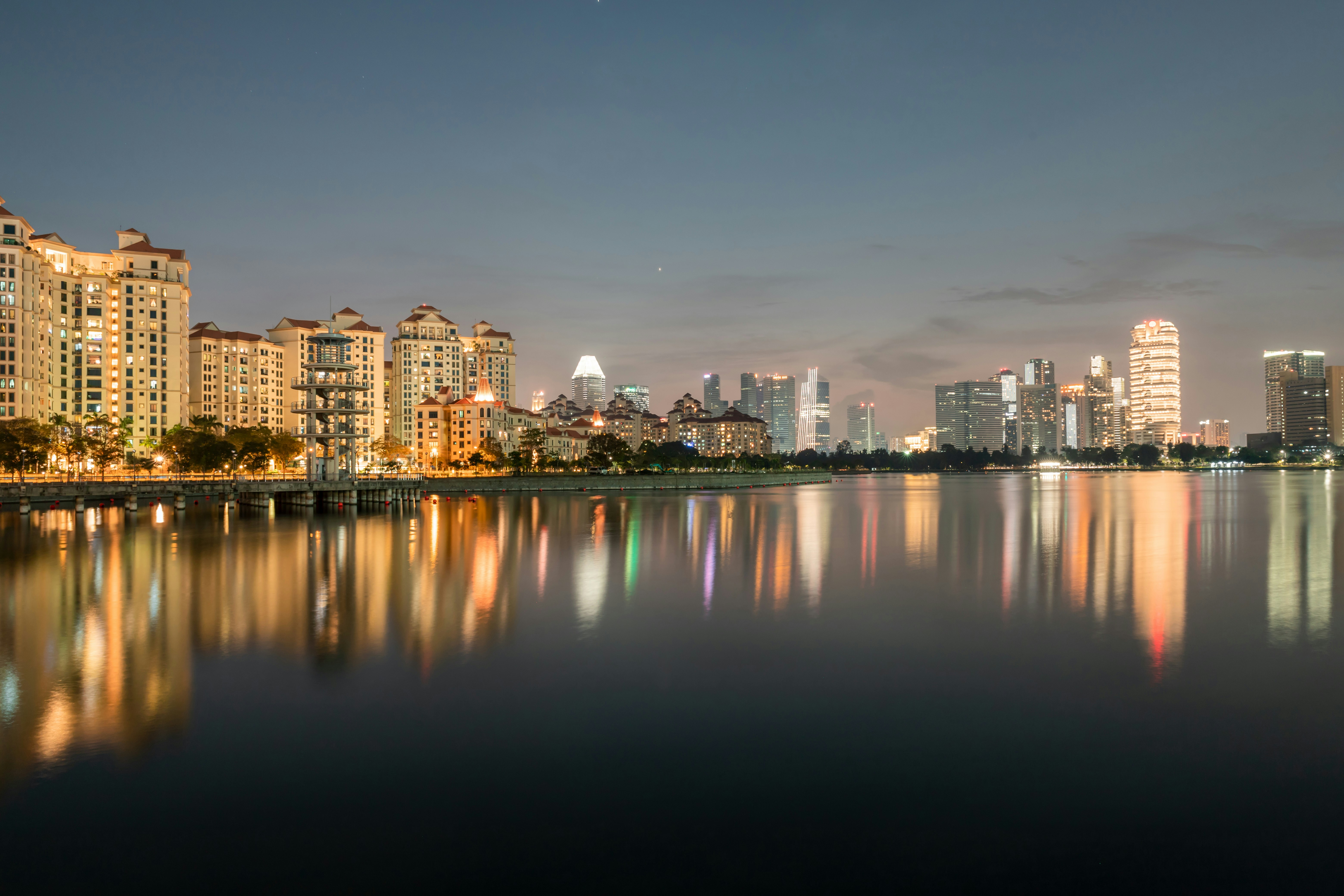High-rise buildings near calm body of water photo – Free Building Image ...