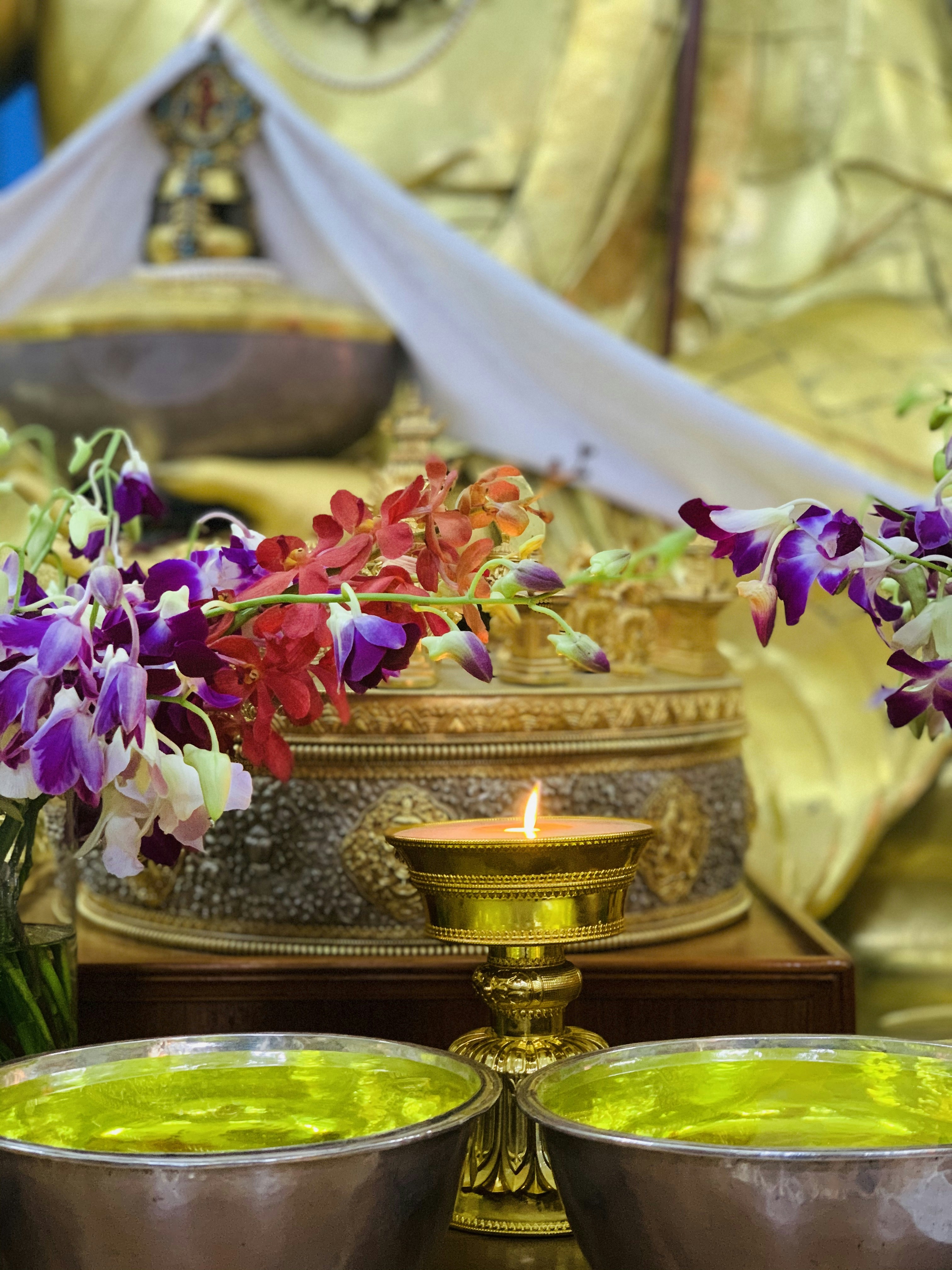 Flame and Fragrance: A Temple Altar Framed by Orchid Silence