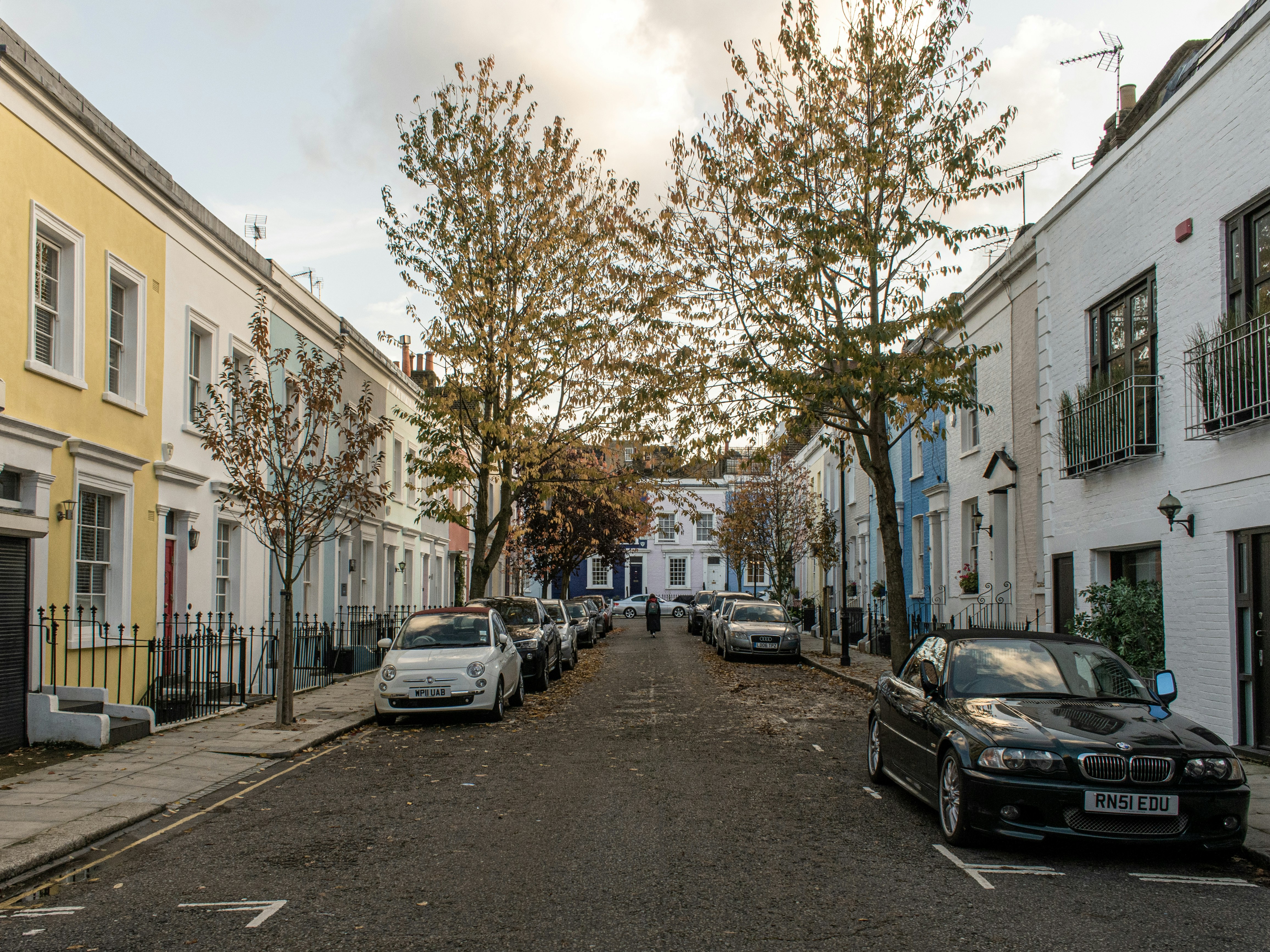 Vehicles park near the street and buildings at daytime photo – Free ...