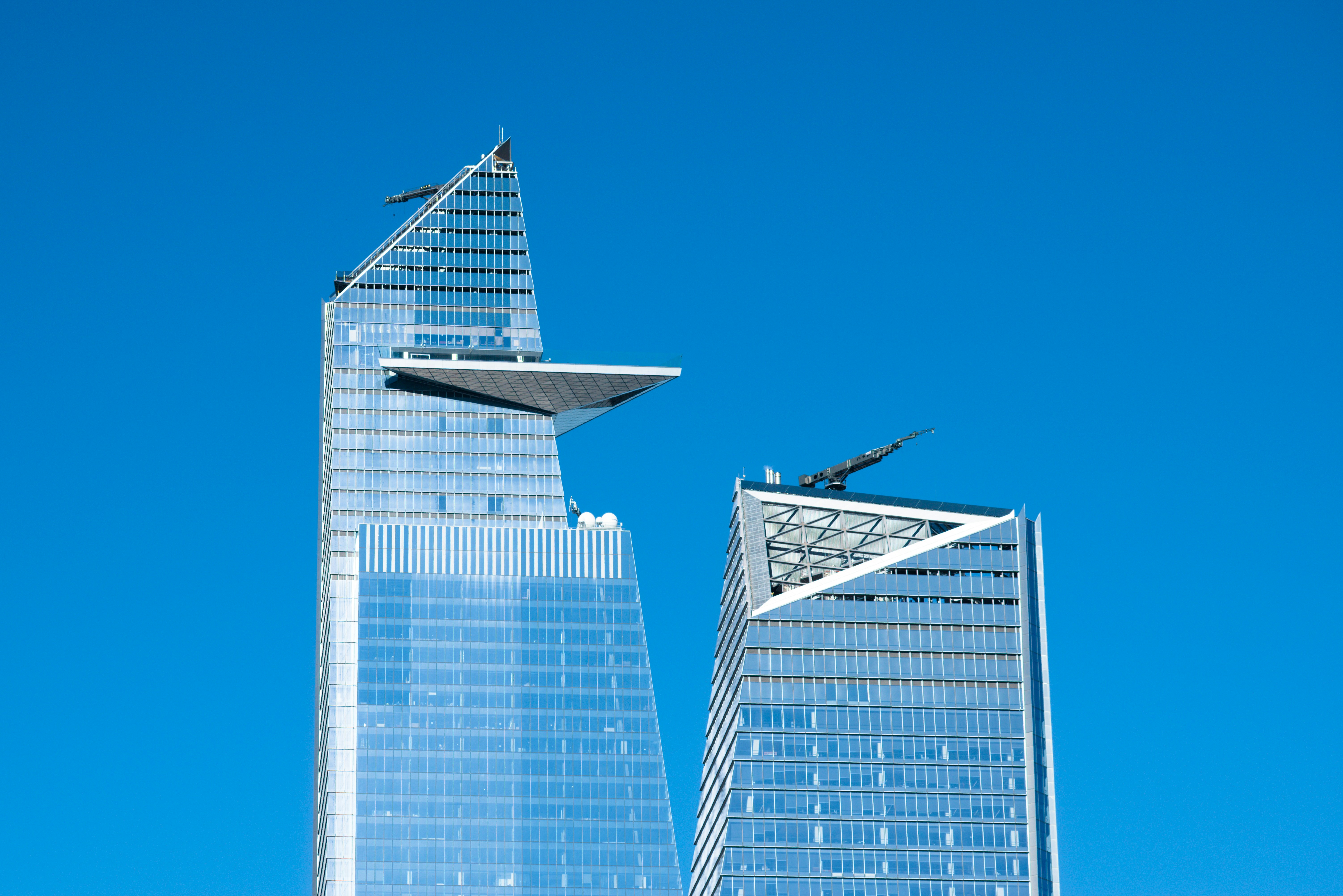 a tall building with a sky scraper on top of itDiChatz
