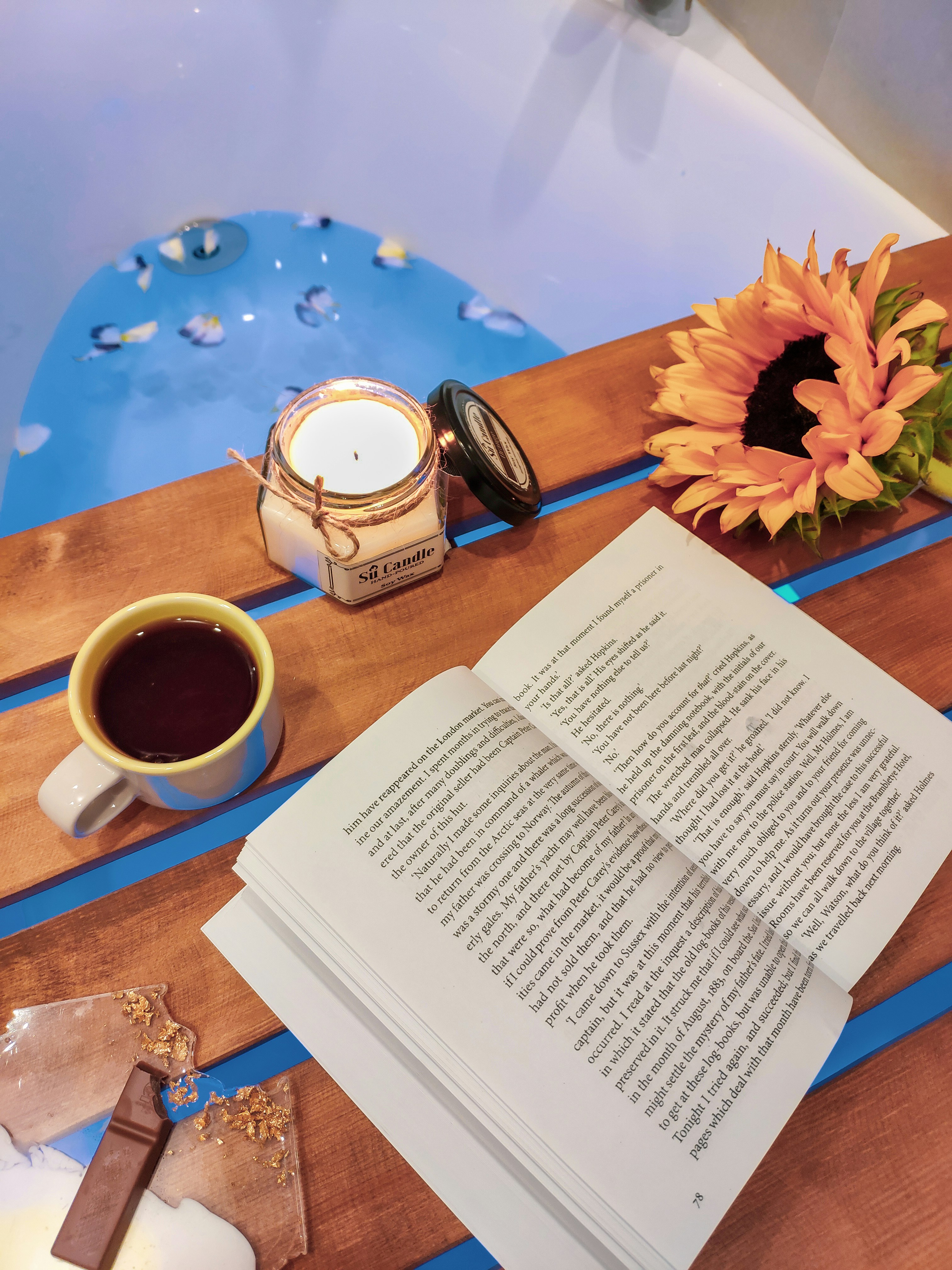 Relaxing in hot tub | open book beside coffee mug