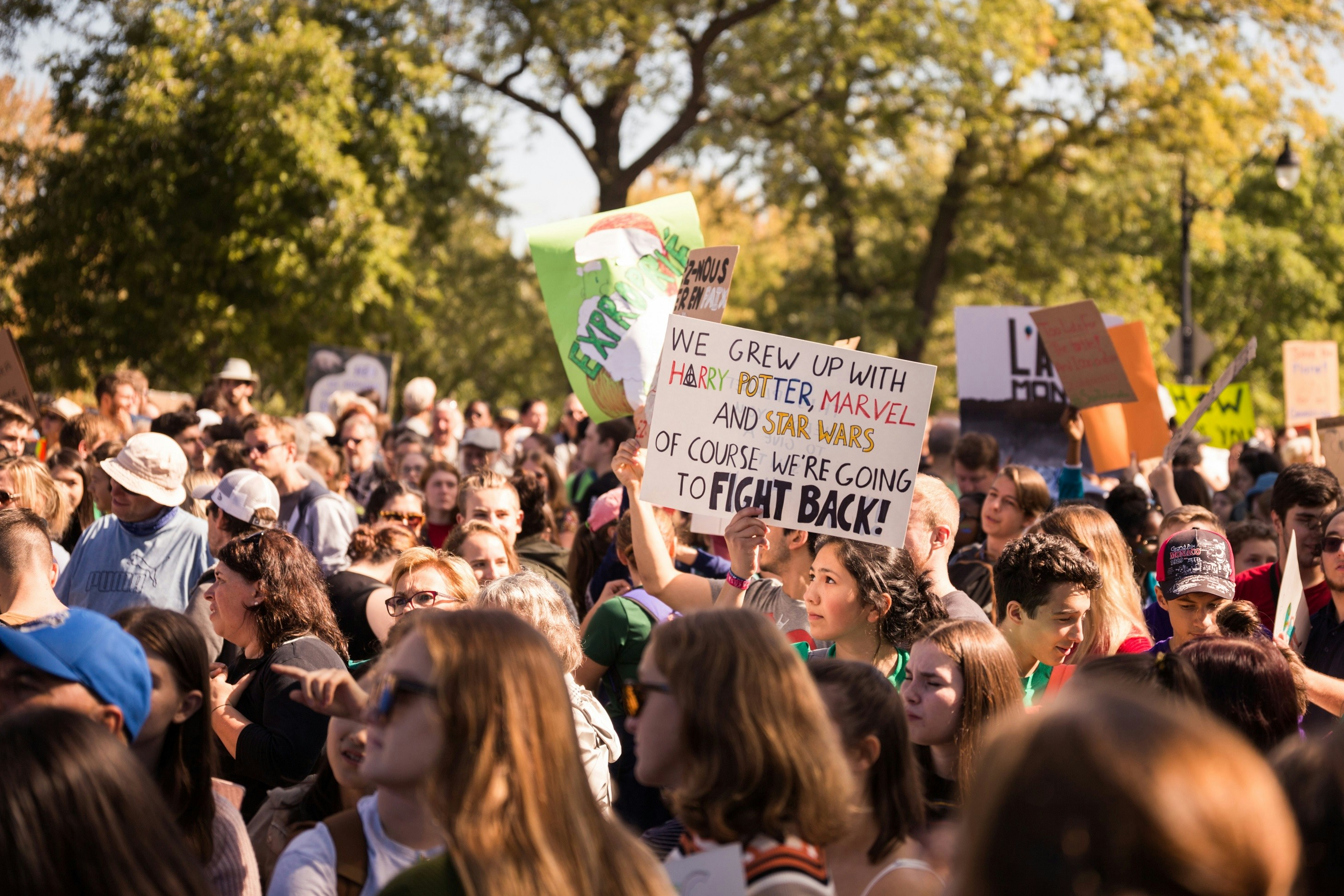 Crowd holding banners photo – Free Montreal Image on Unsplash