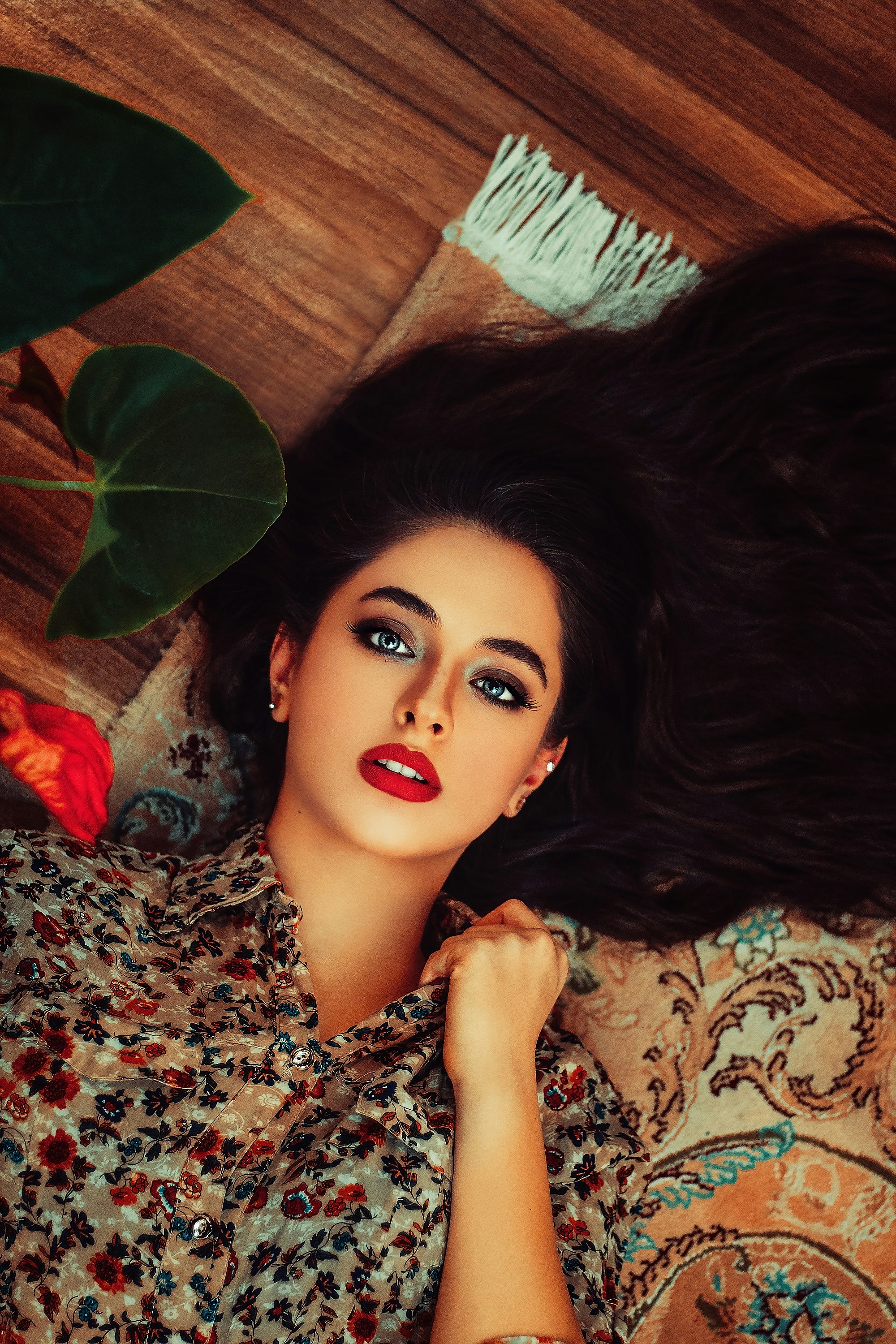 Midnight Bloom: A Portrait of Velvet Hair and Red Lips on a Floral Canvas
