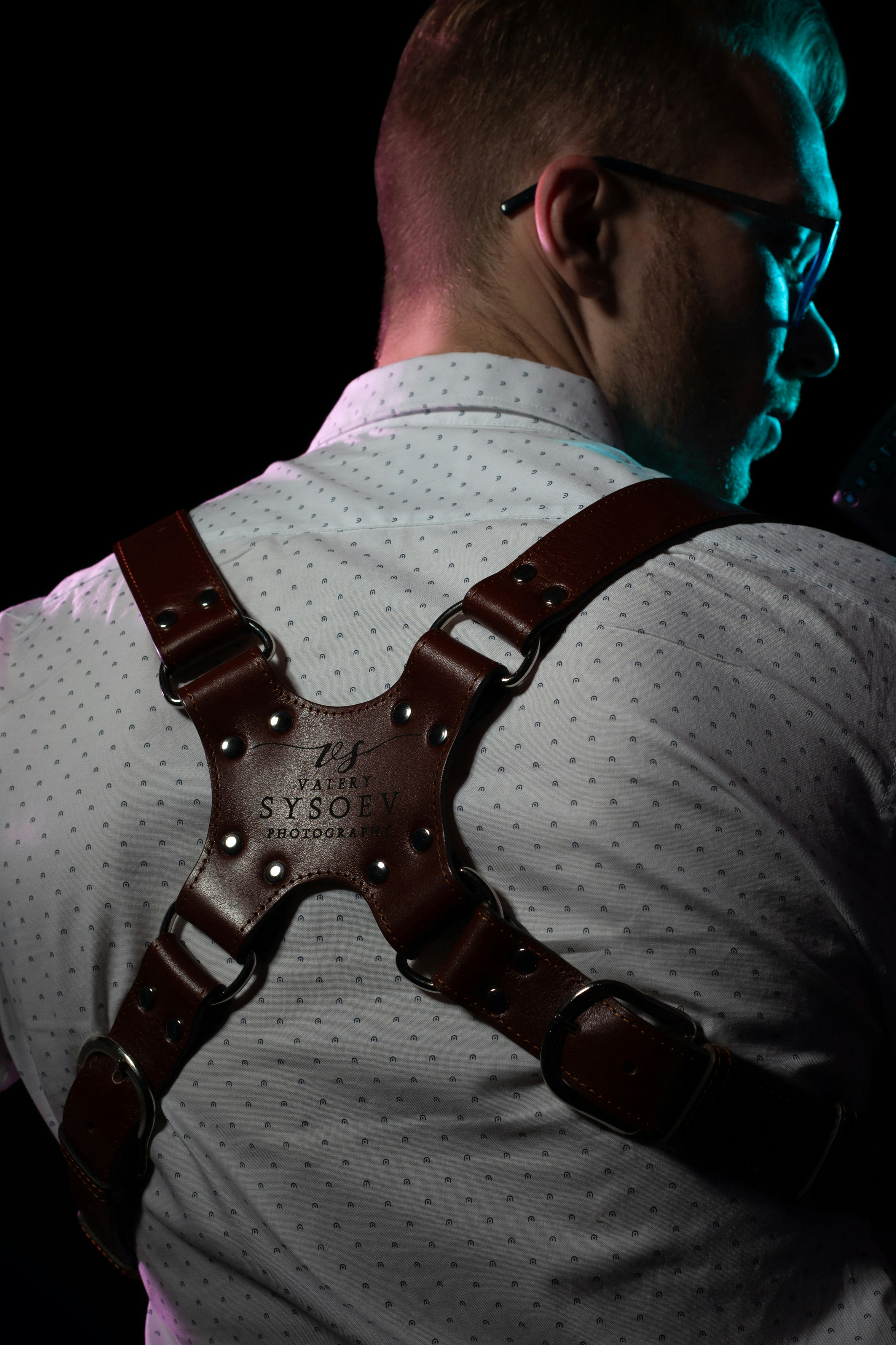 A man wearing a leather harness and glasses photo – Free Human Image on ...
