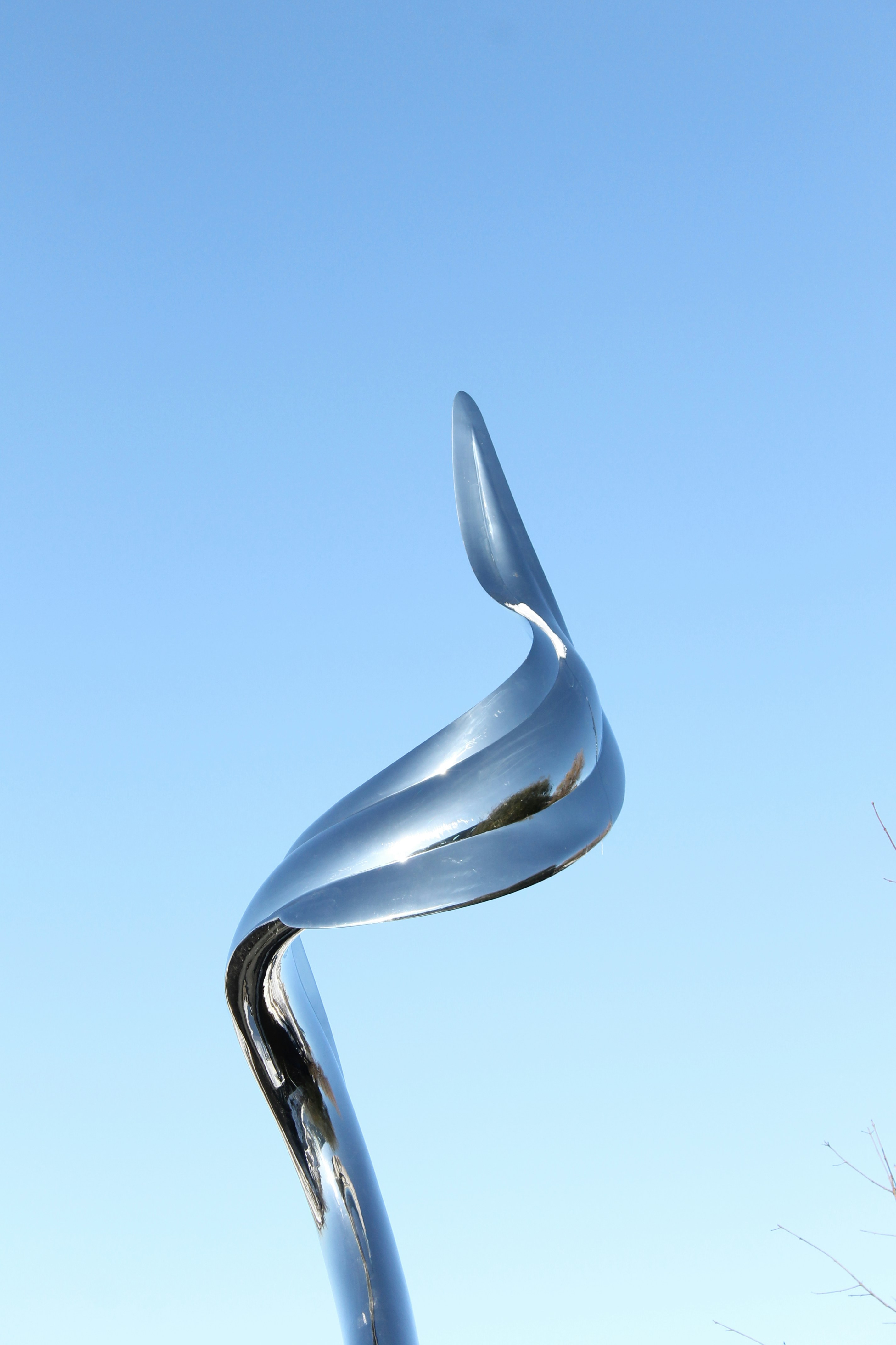Chrome Ribbon Spiral Bending Skyward