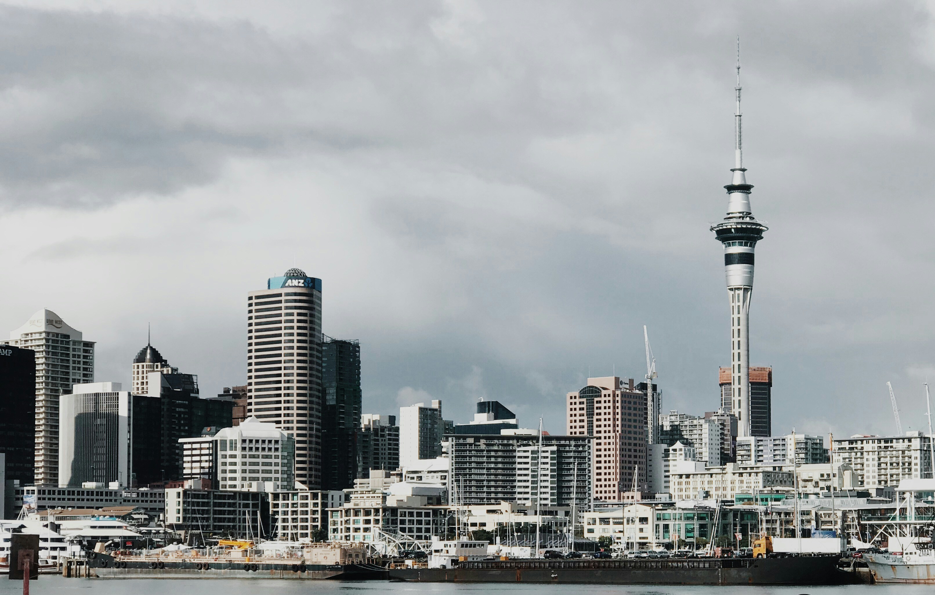 City with high-rise buildings viewing body of water under white and ...