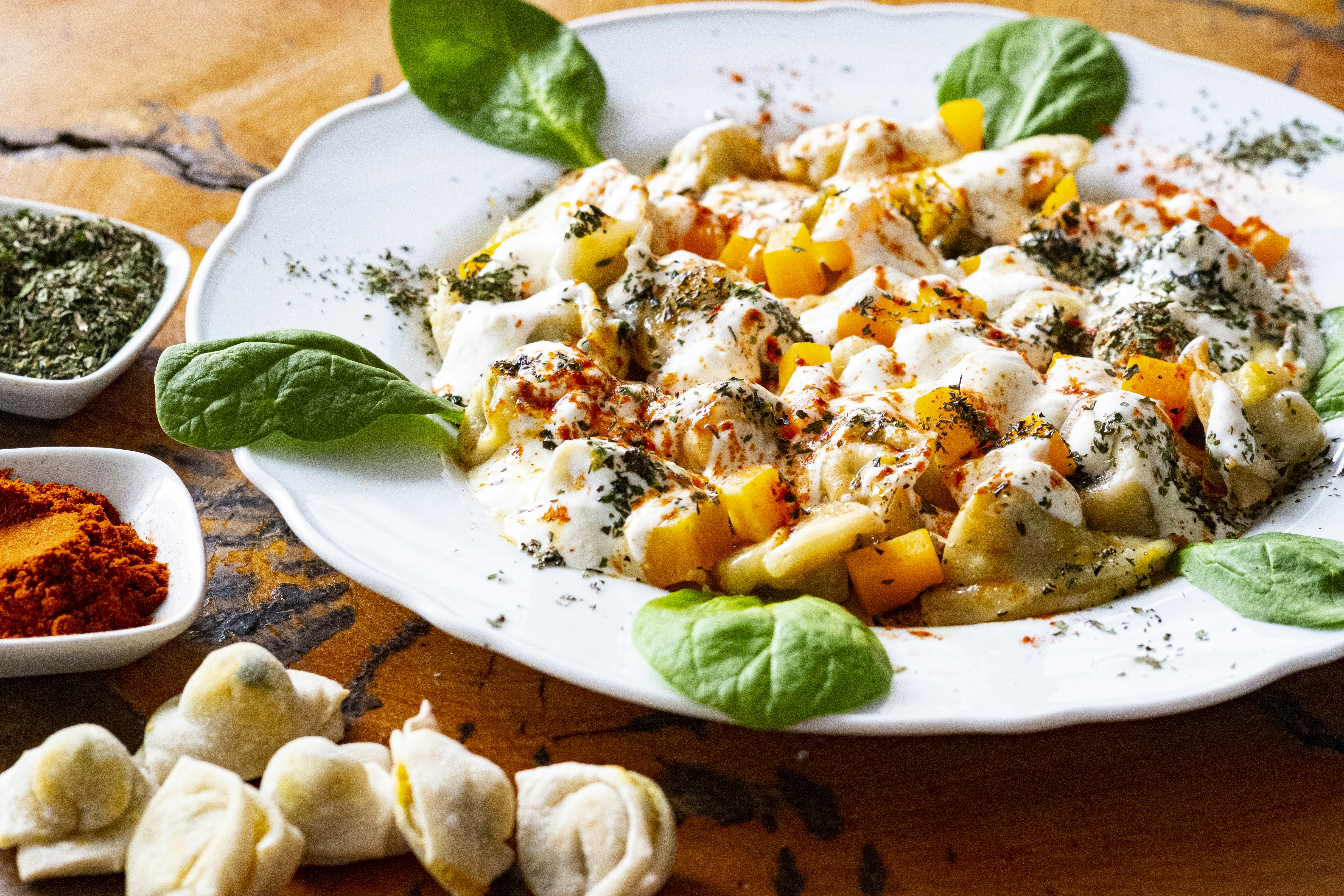 Creamy Gnocchi Mosaic with Pepper Dice on a Rustic Plate