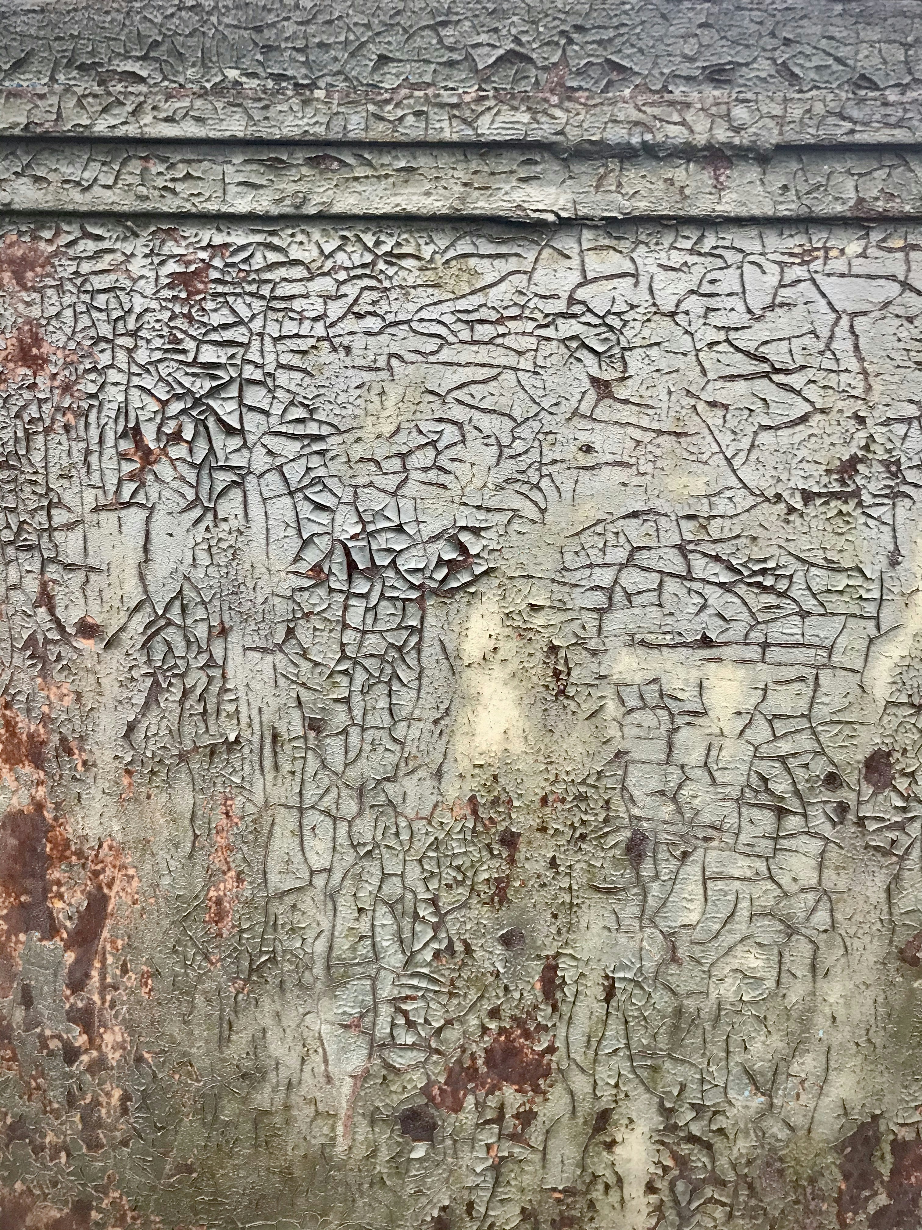 a close up of a wall with graffiti on it