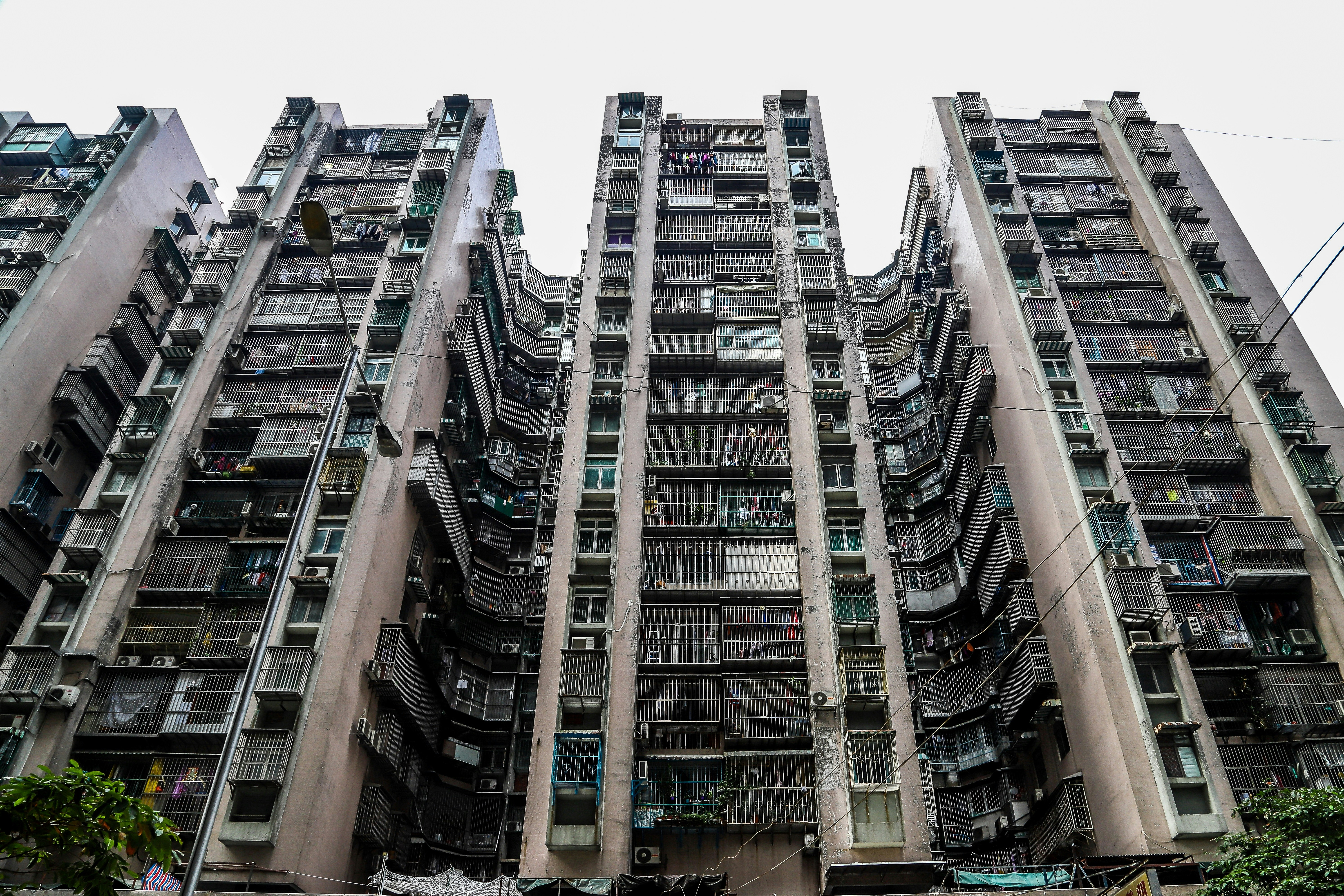 Low-angle photography of black and gray concrete high-rise building ...