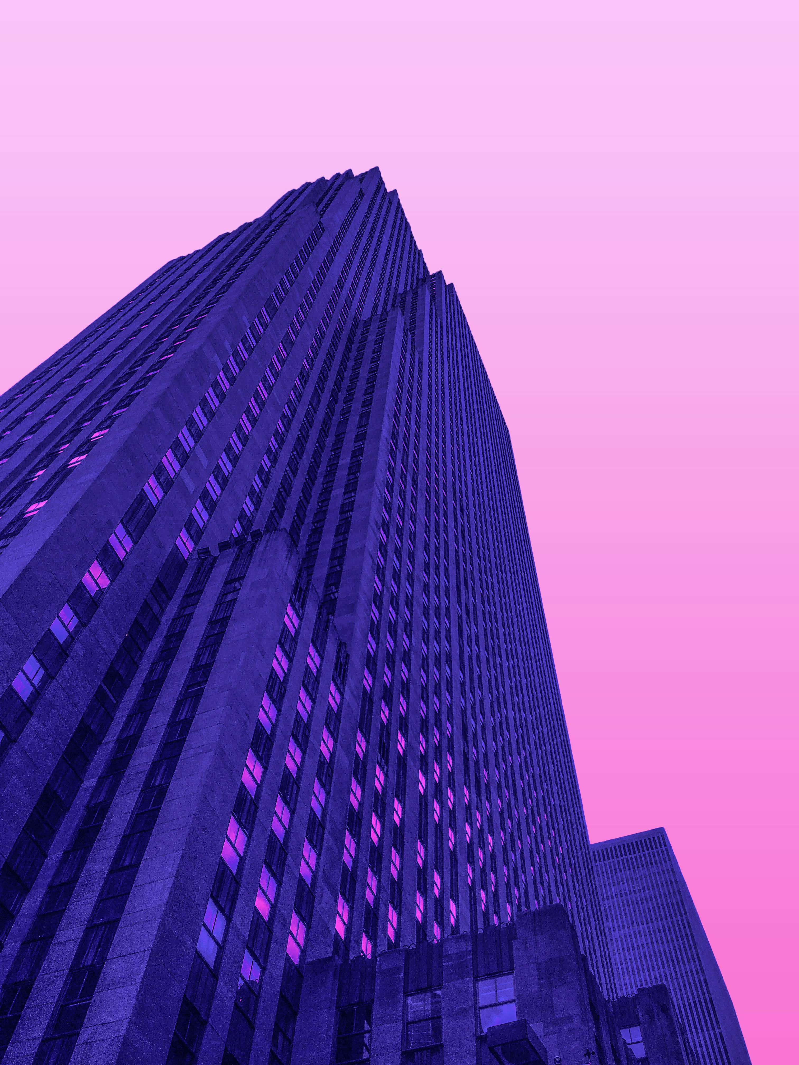 Neon-Blue Tower Pierces a Magenta Sky