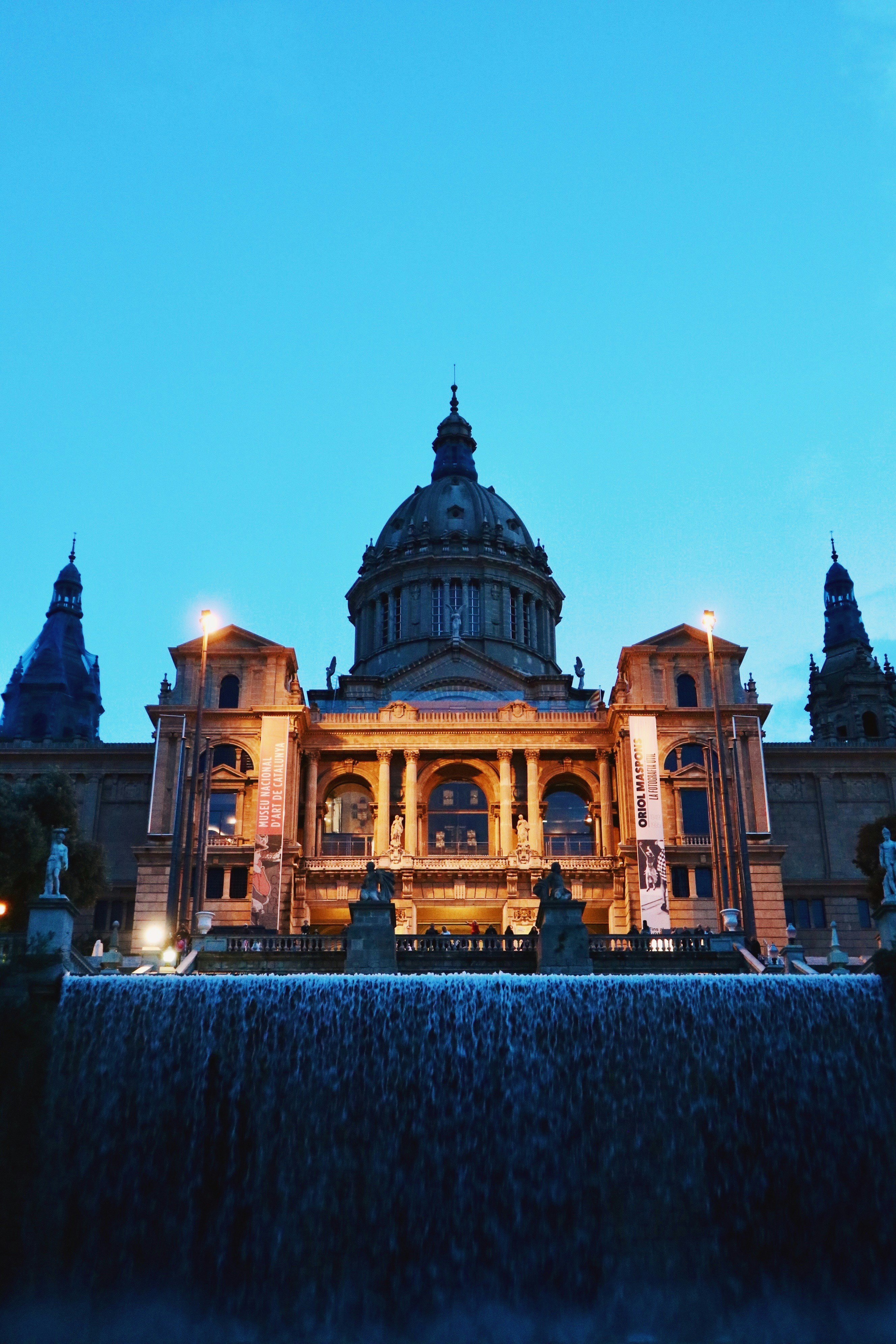 Low-angle photography of lighted dome building under a calm blue sky ...