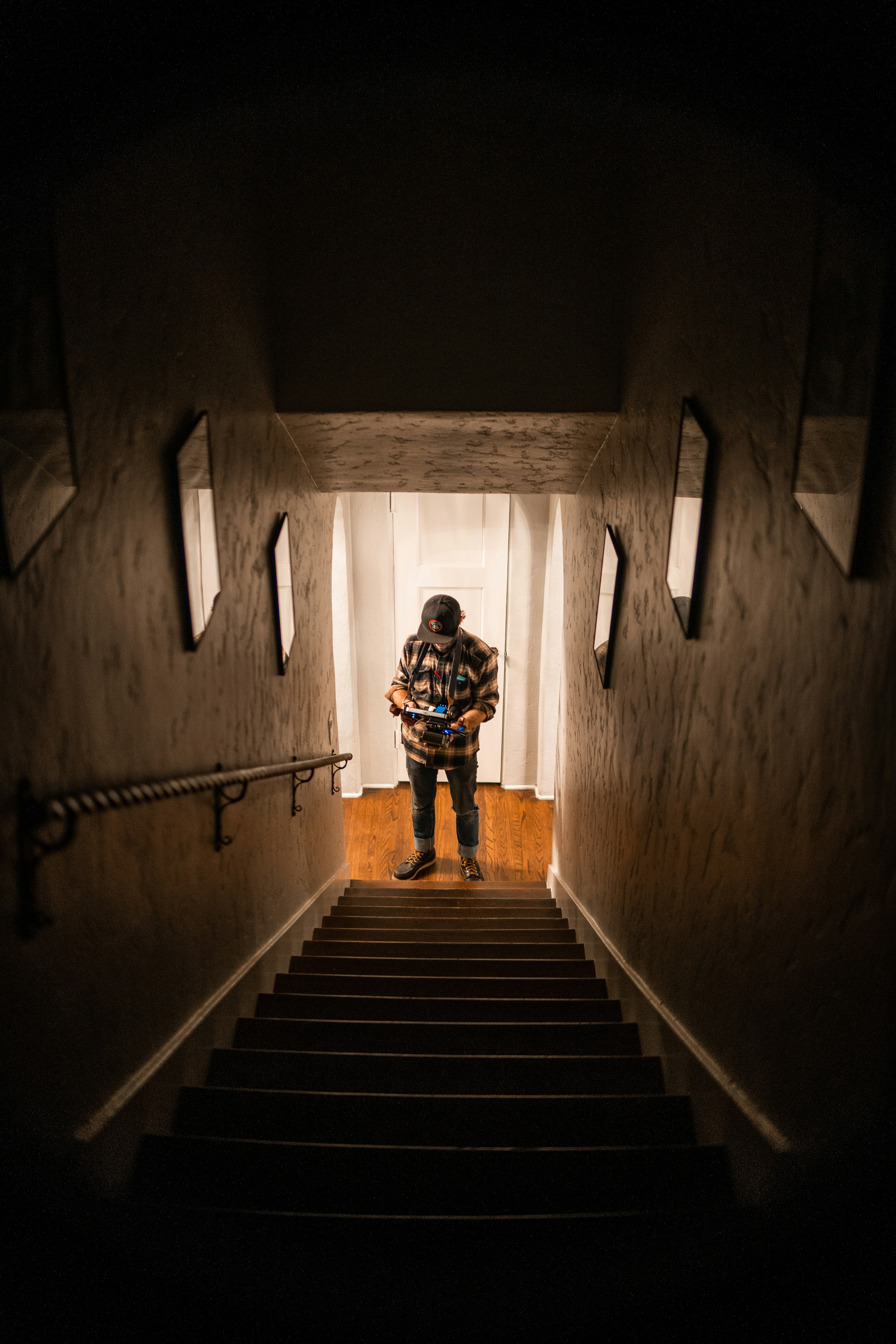 Man standing at the bottom of a staircase photo – Free Human Image on ...