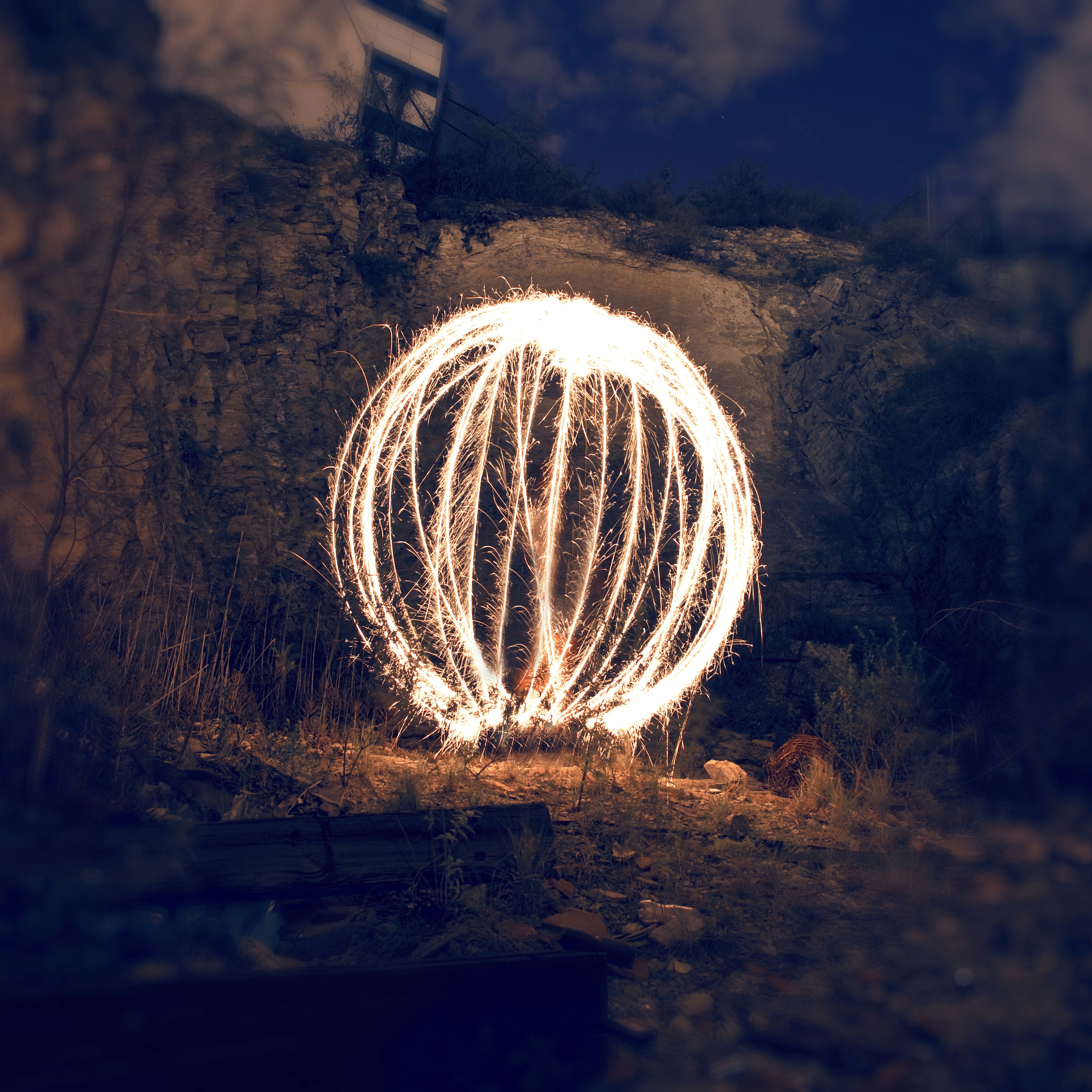 Orbital Firework: A Lone Sparkler Tracing a Luminous Ring in the Night