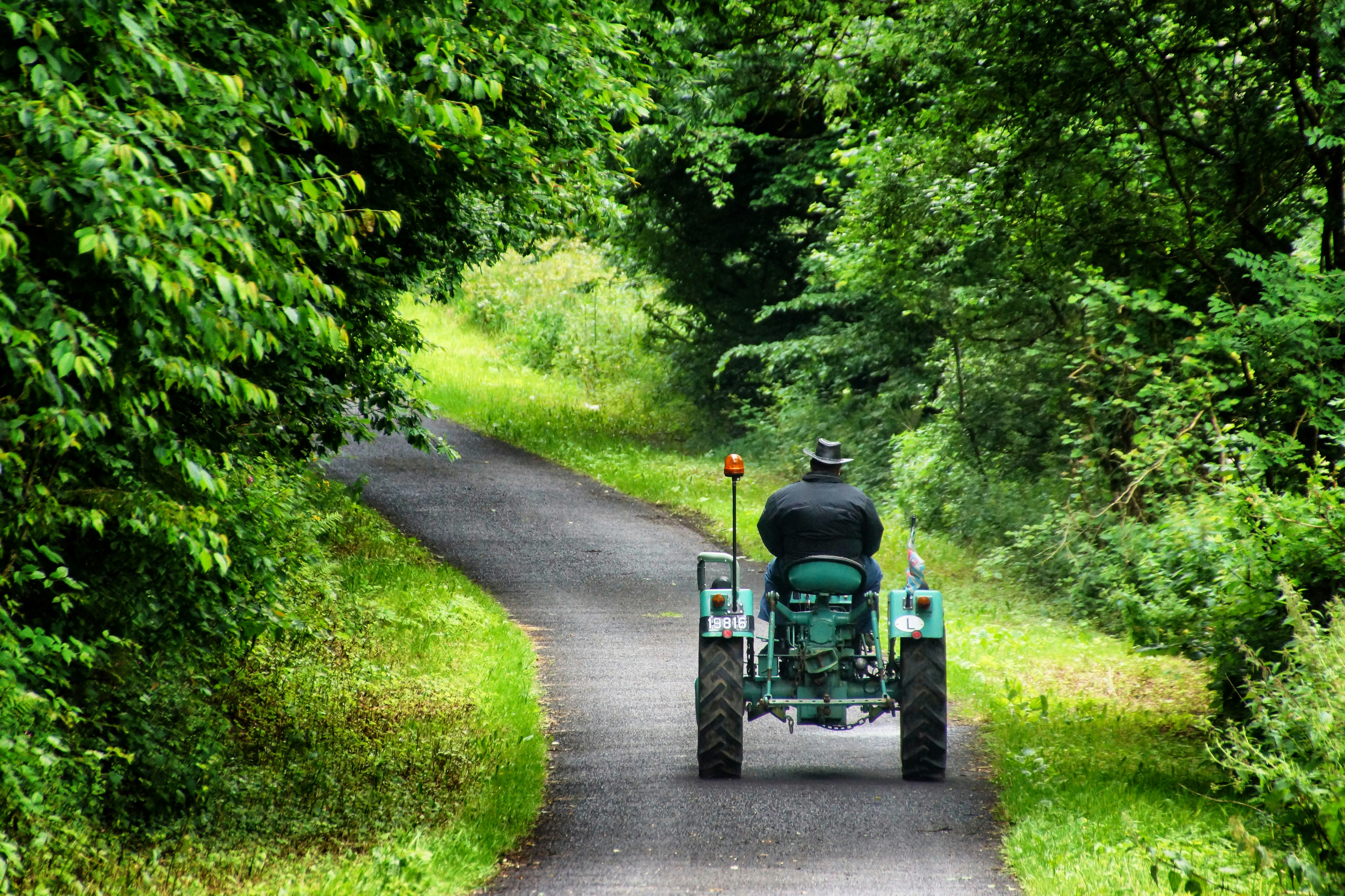 Man riding tractor photo – Free Machine Image on Unsplash