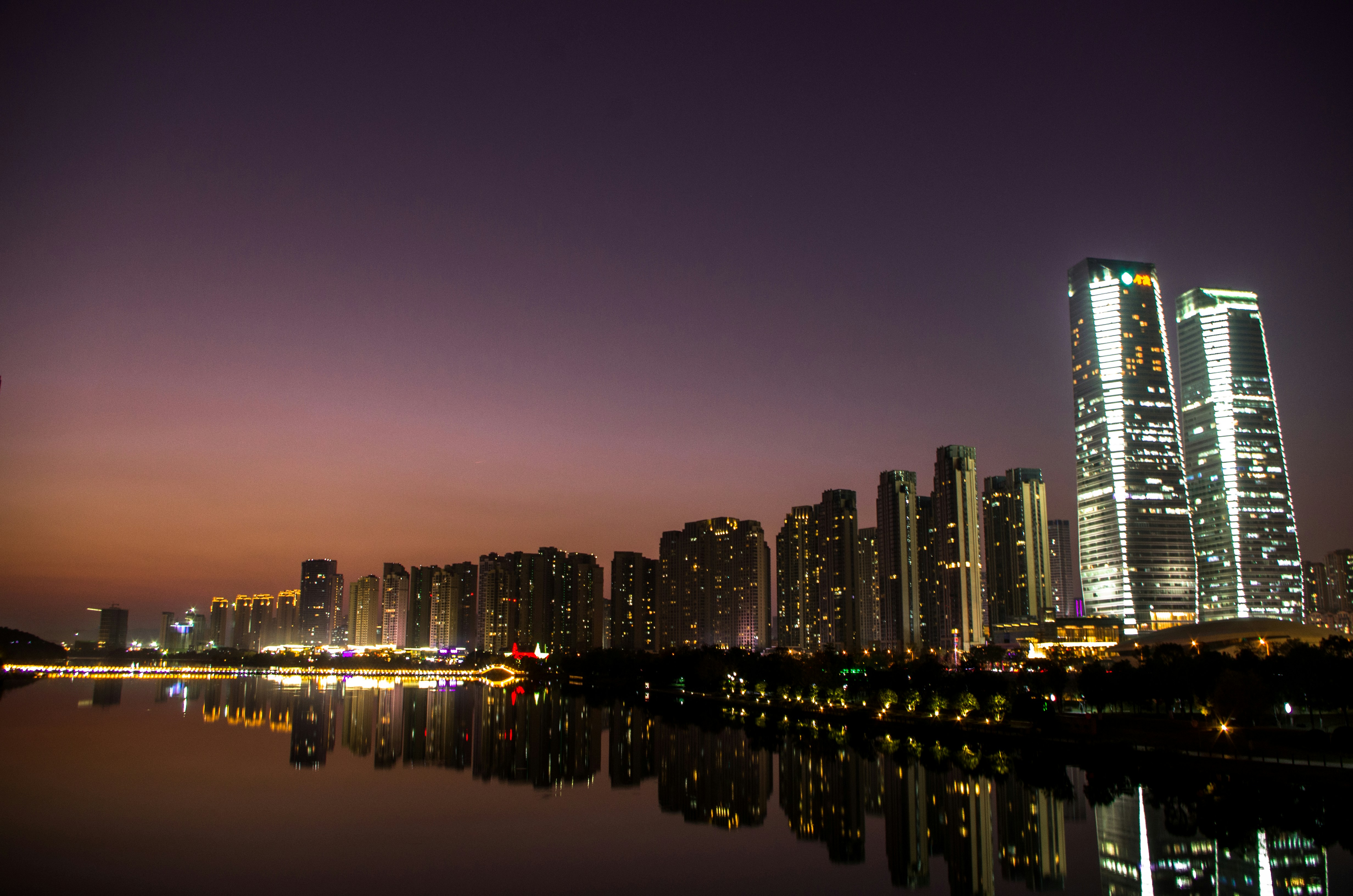 View photography of lighted city buildings during nighttime photo ...