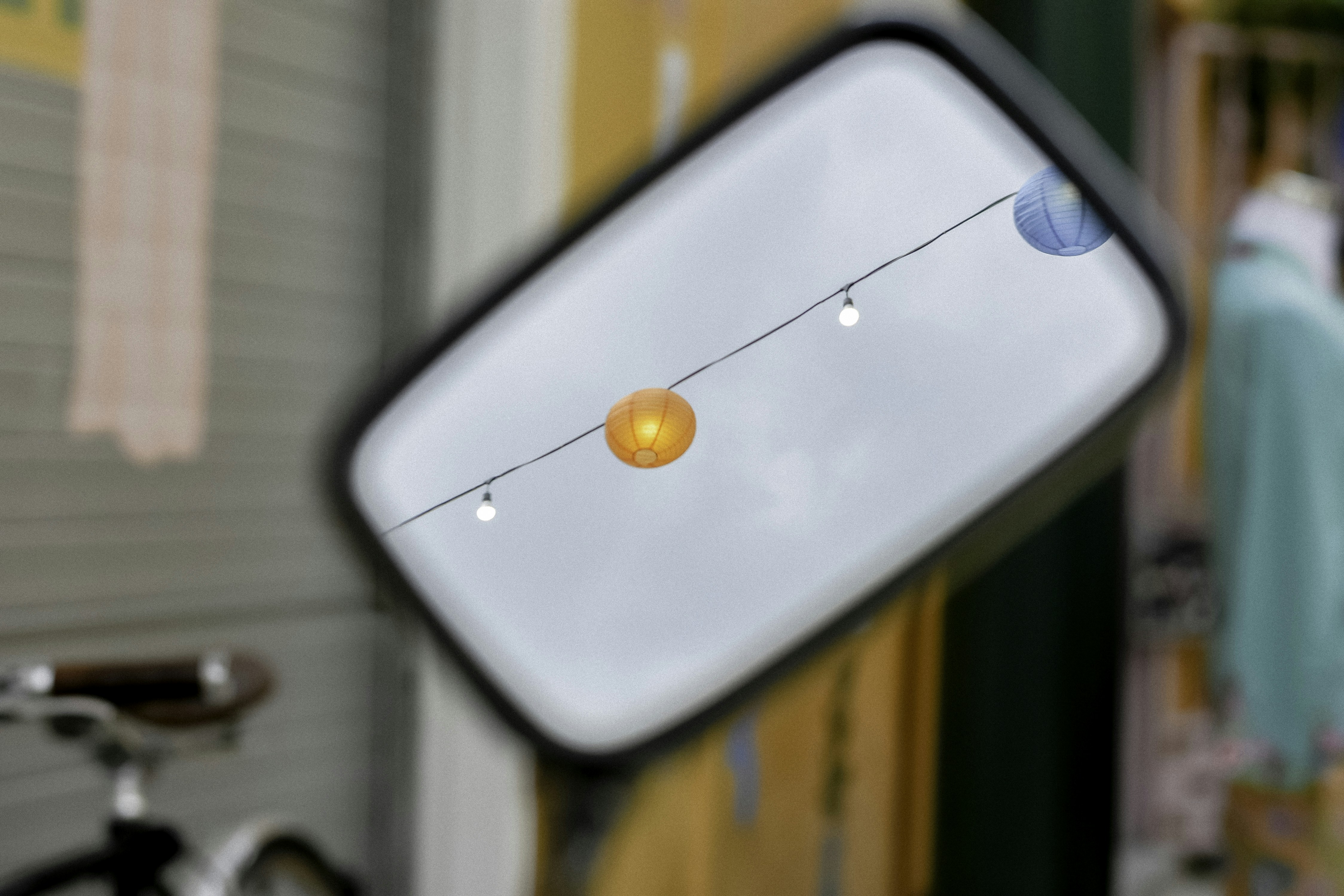 Tilted Mirror Lantern: A Cozy Urban Glow Framed by Glass