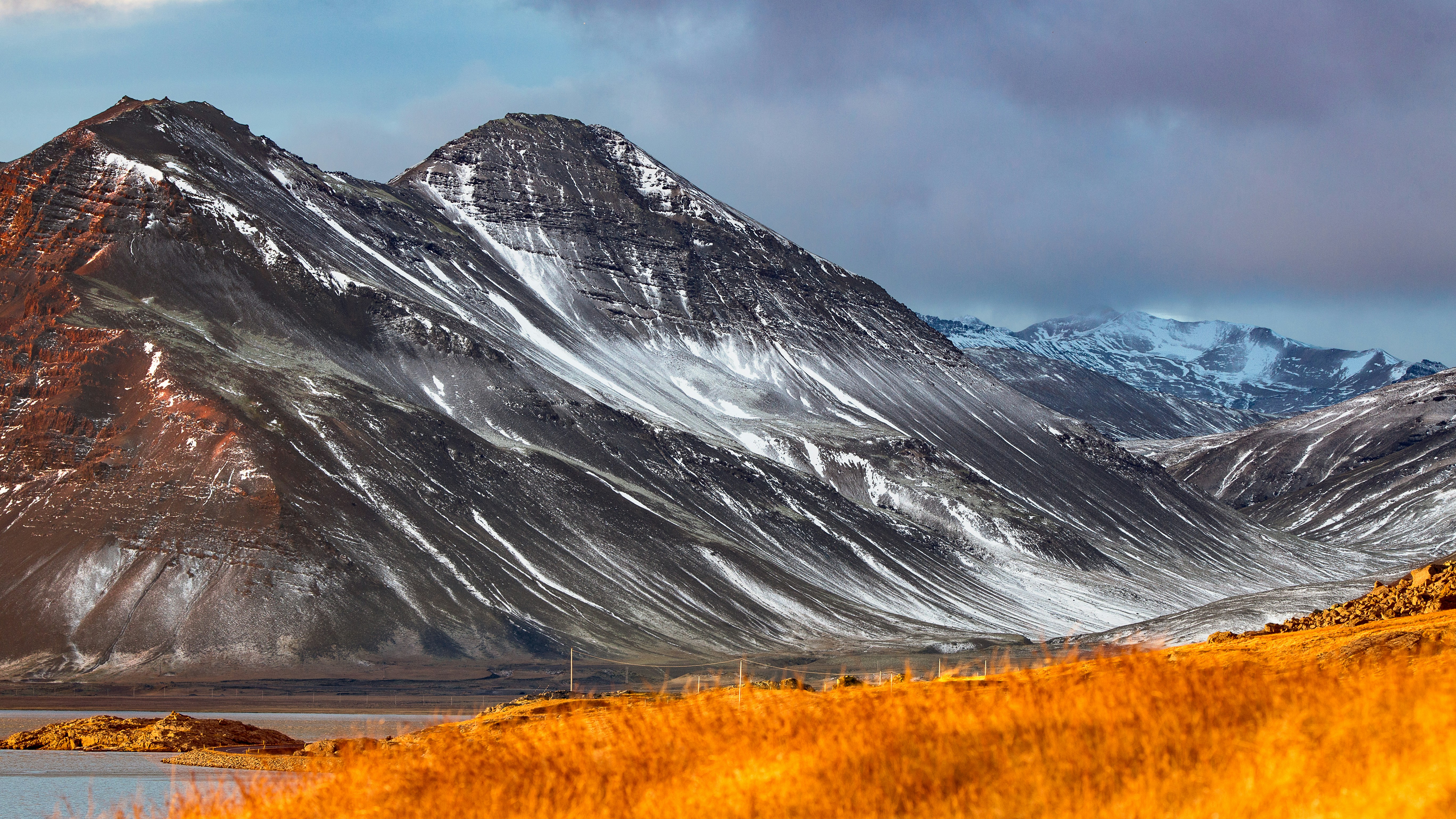 Snowy black mountains at sunrise