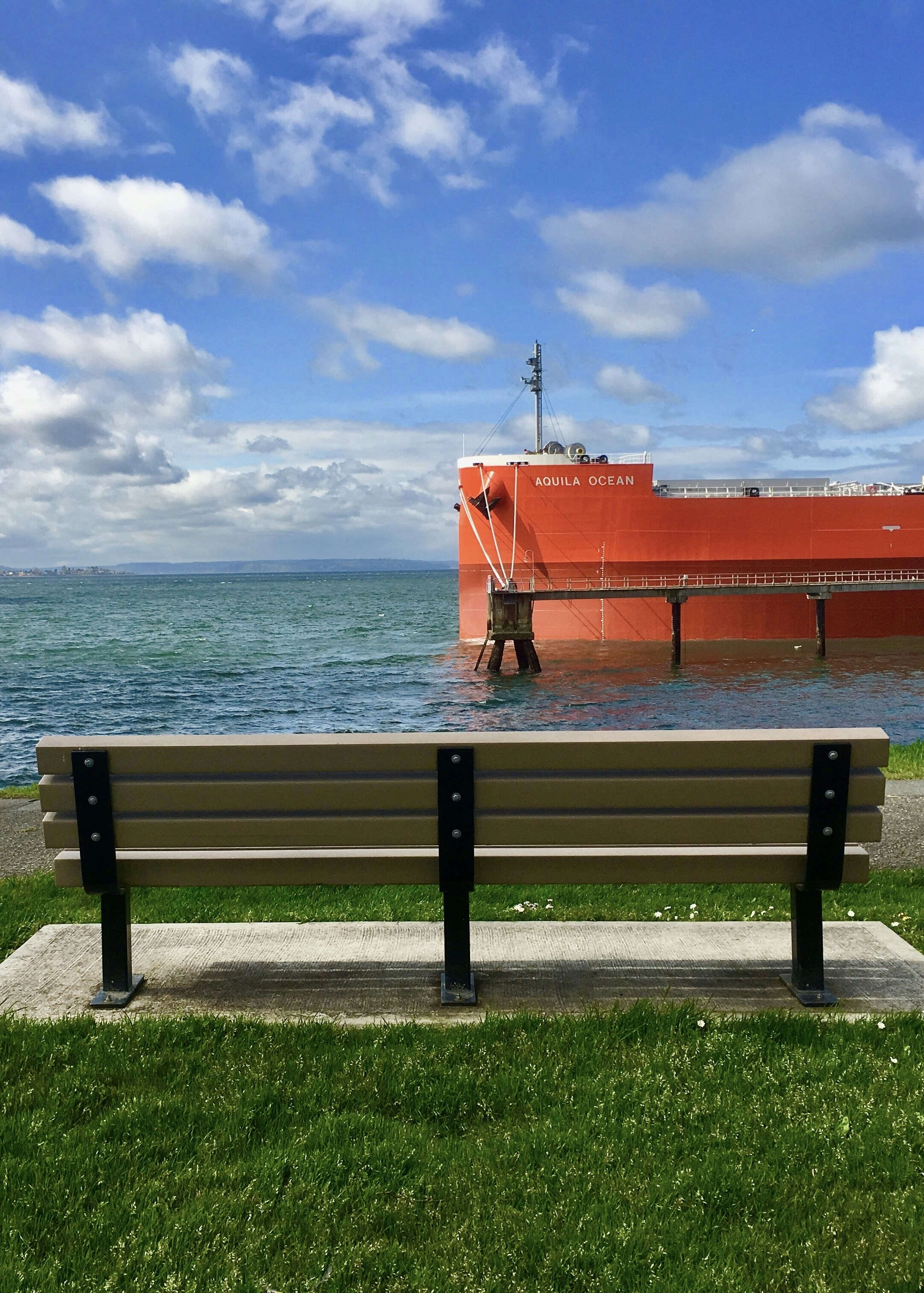 Red Vessel at the Pier: A Quiet Seaside Moment