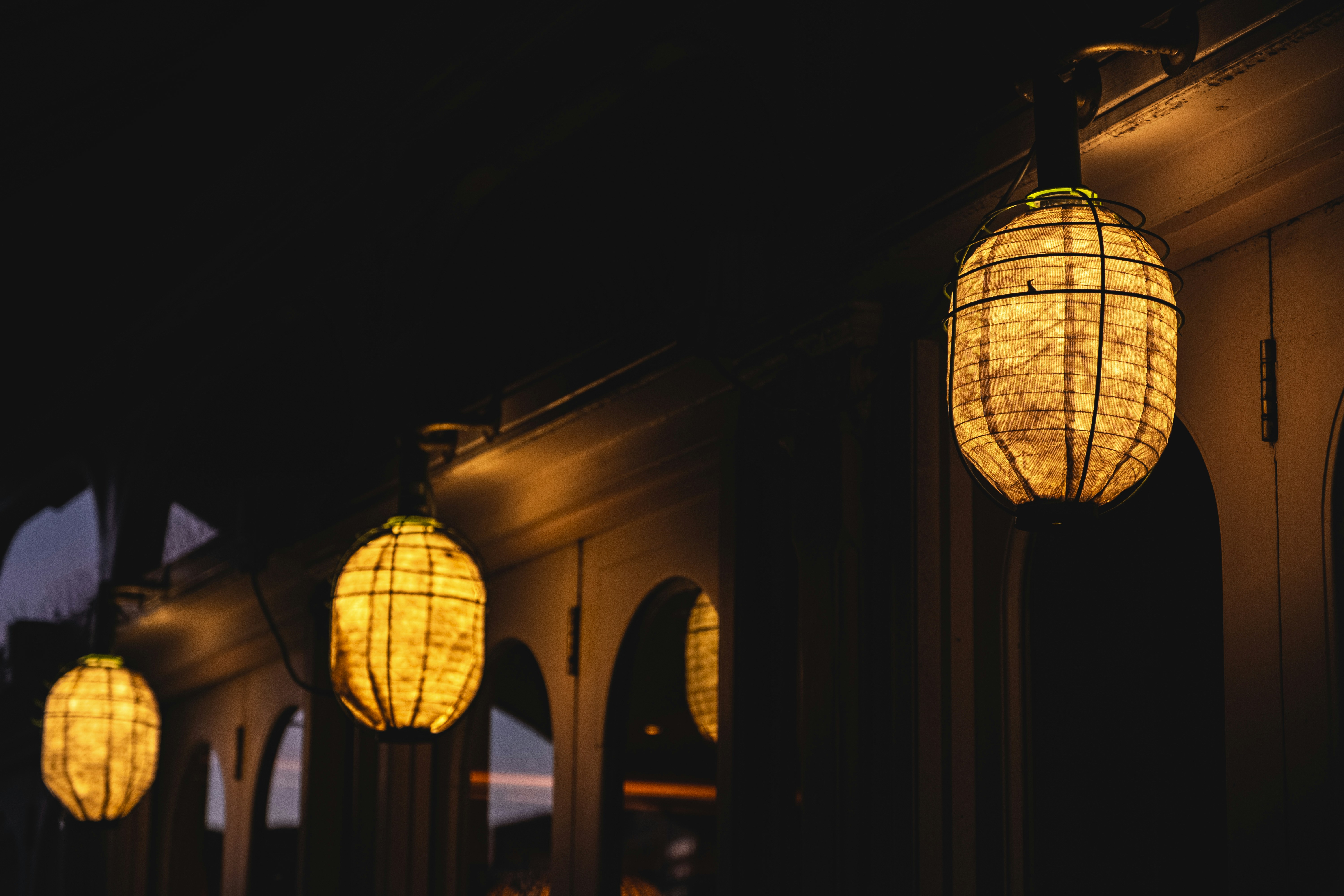 Lightened lanterns in front of buildings photo – Free Lamp Image on ...