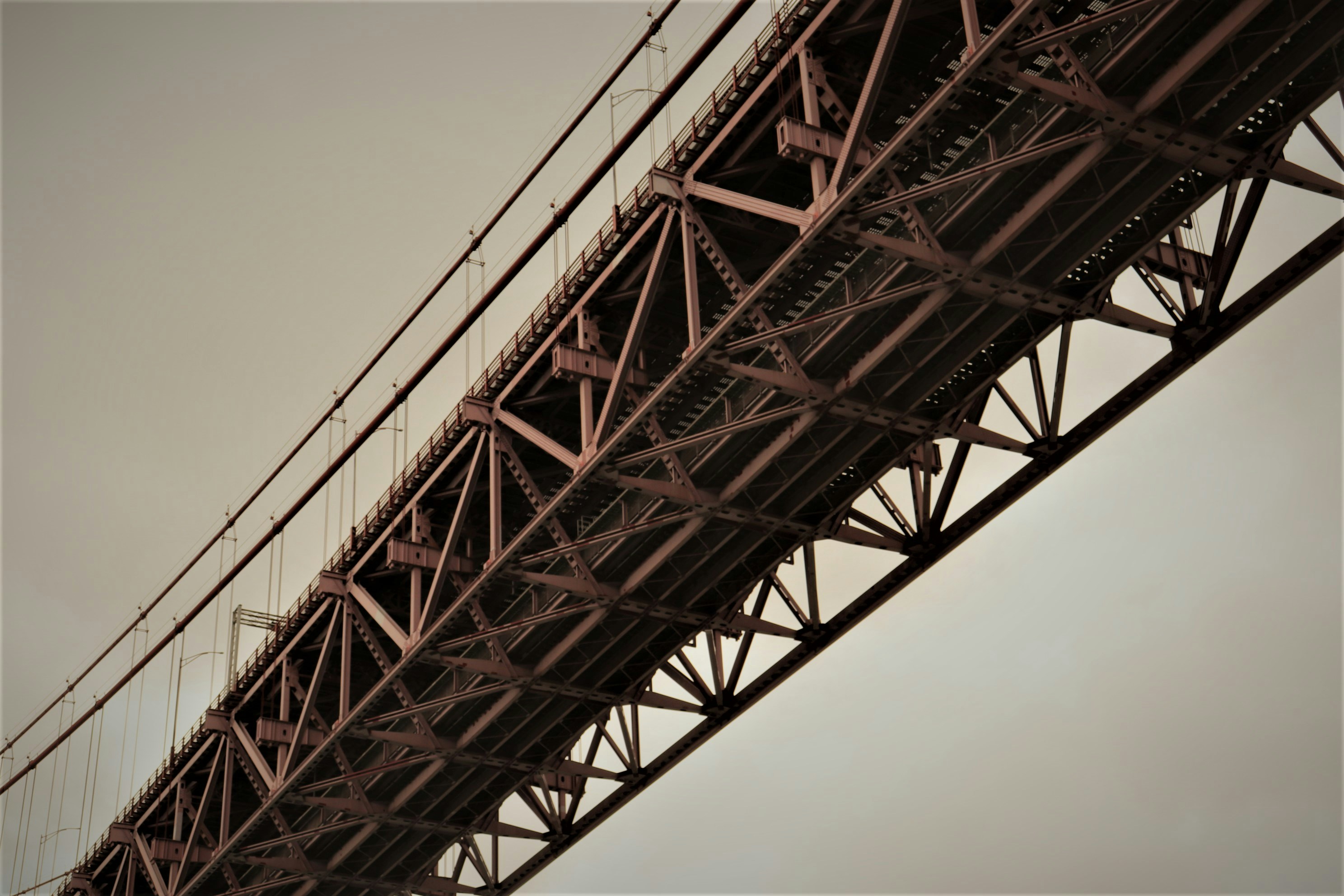 red concrete bridge under gray skies