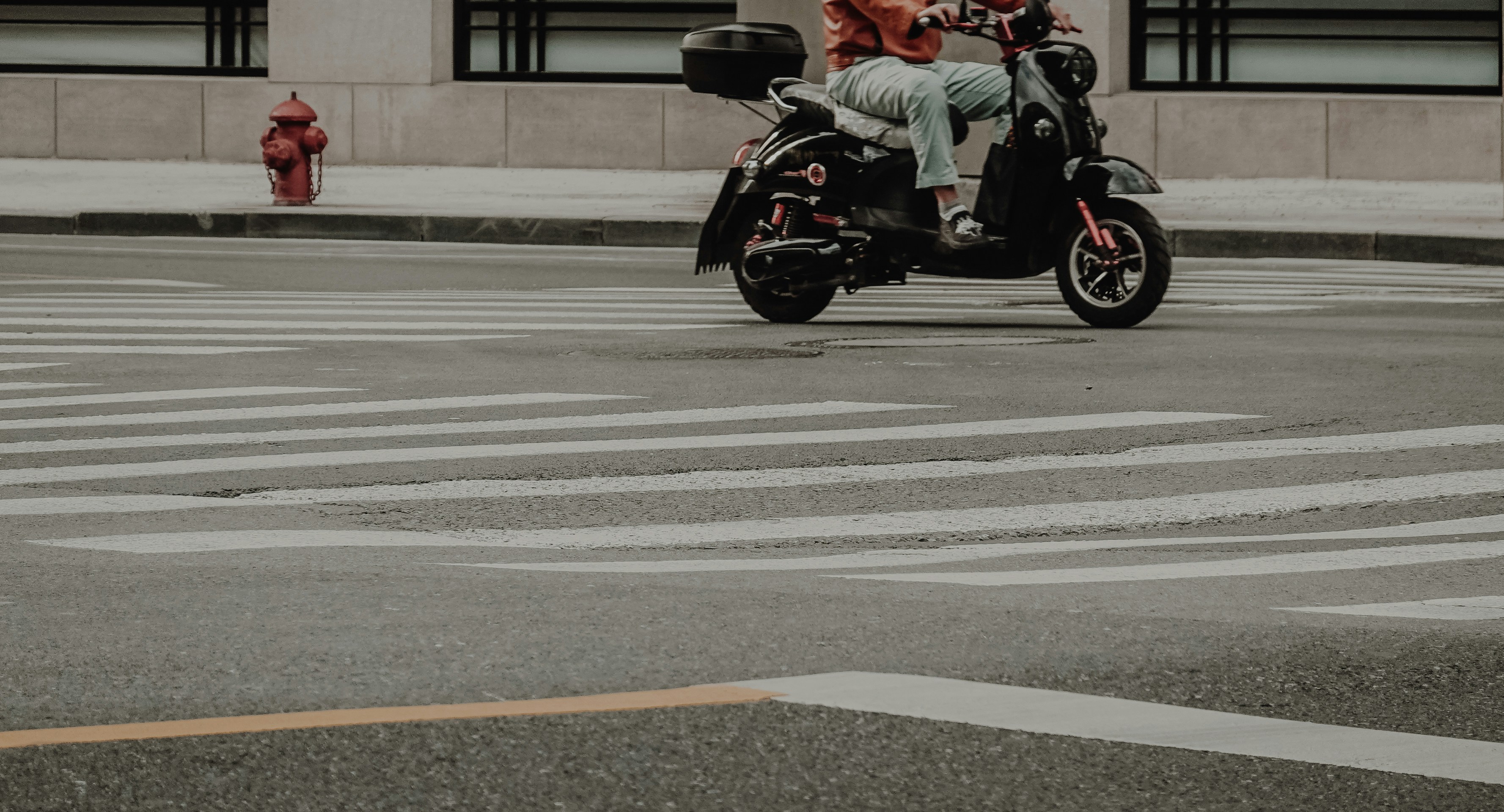 Person riding motor scooter photo – Free Grey Image on Unsplash