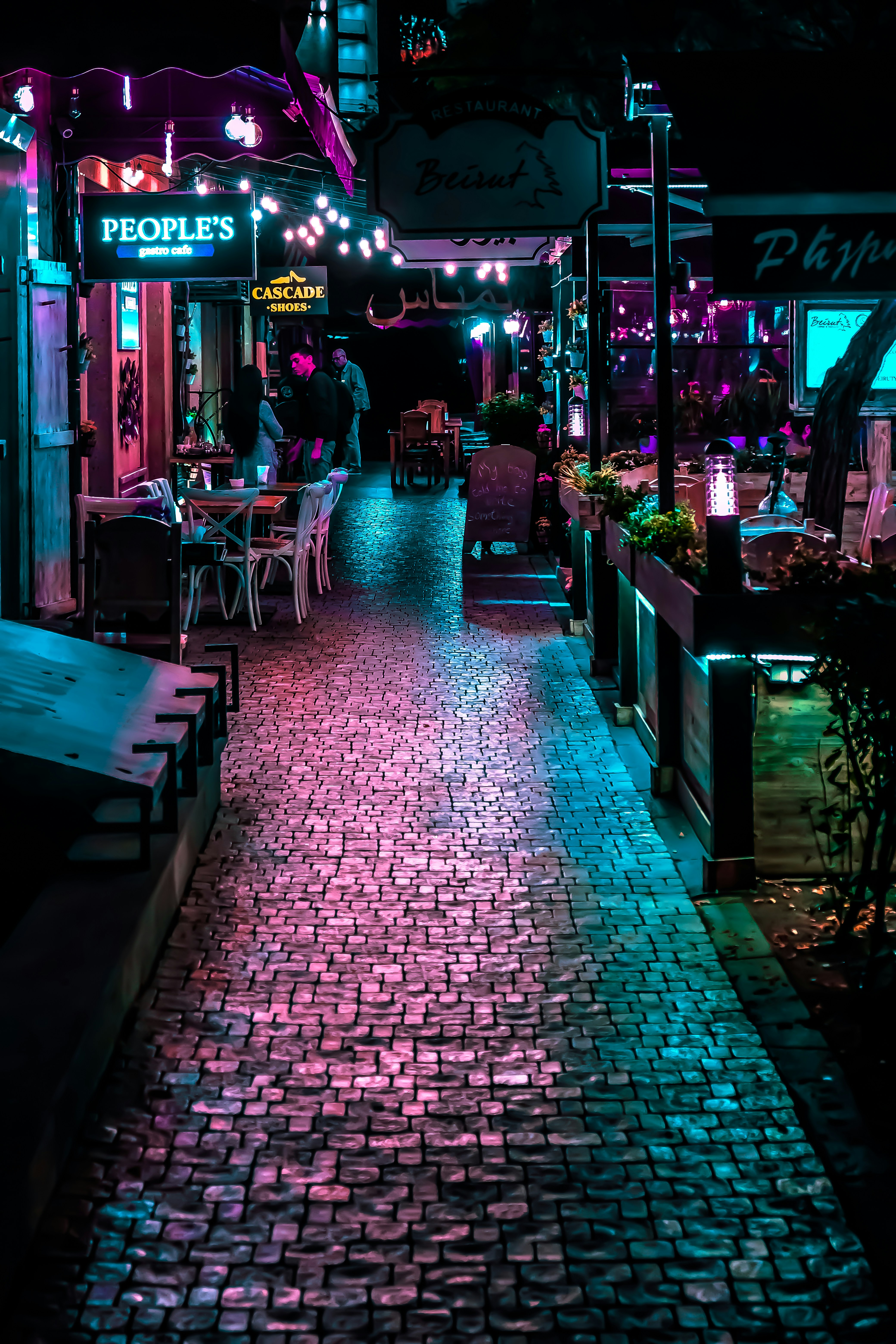Neon Alley Café: A Cobblestone Night in Blue and Pink