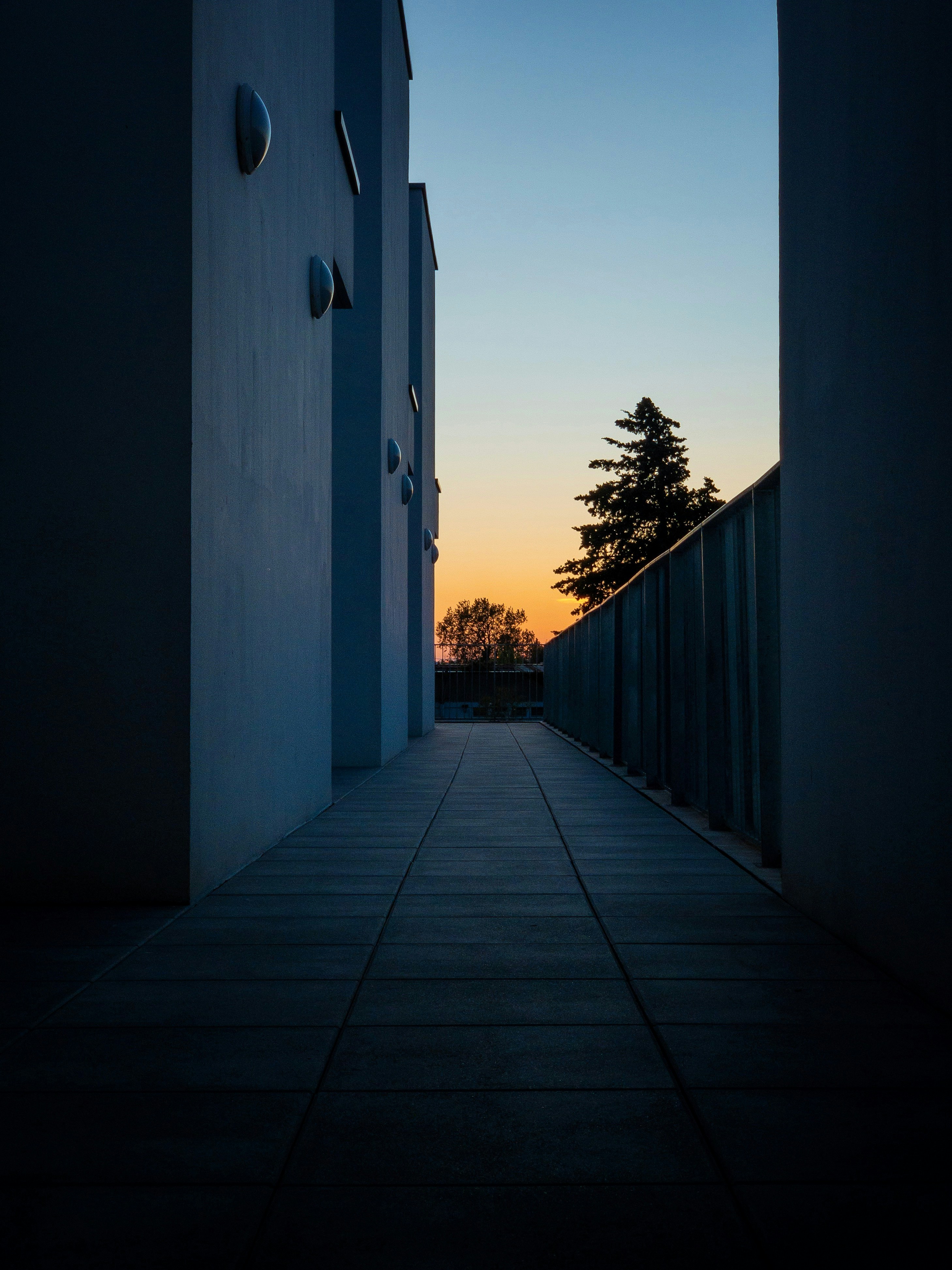 Twilight Corridor: A Sunset Path Between Modern Facades