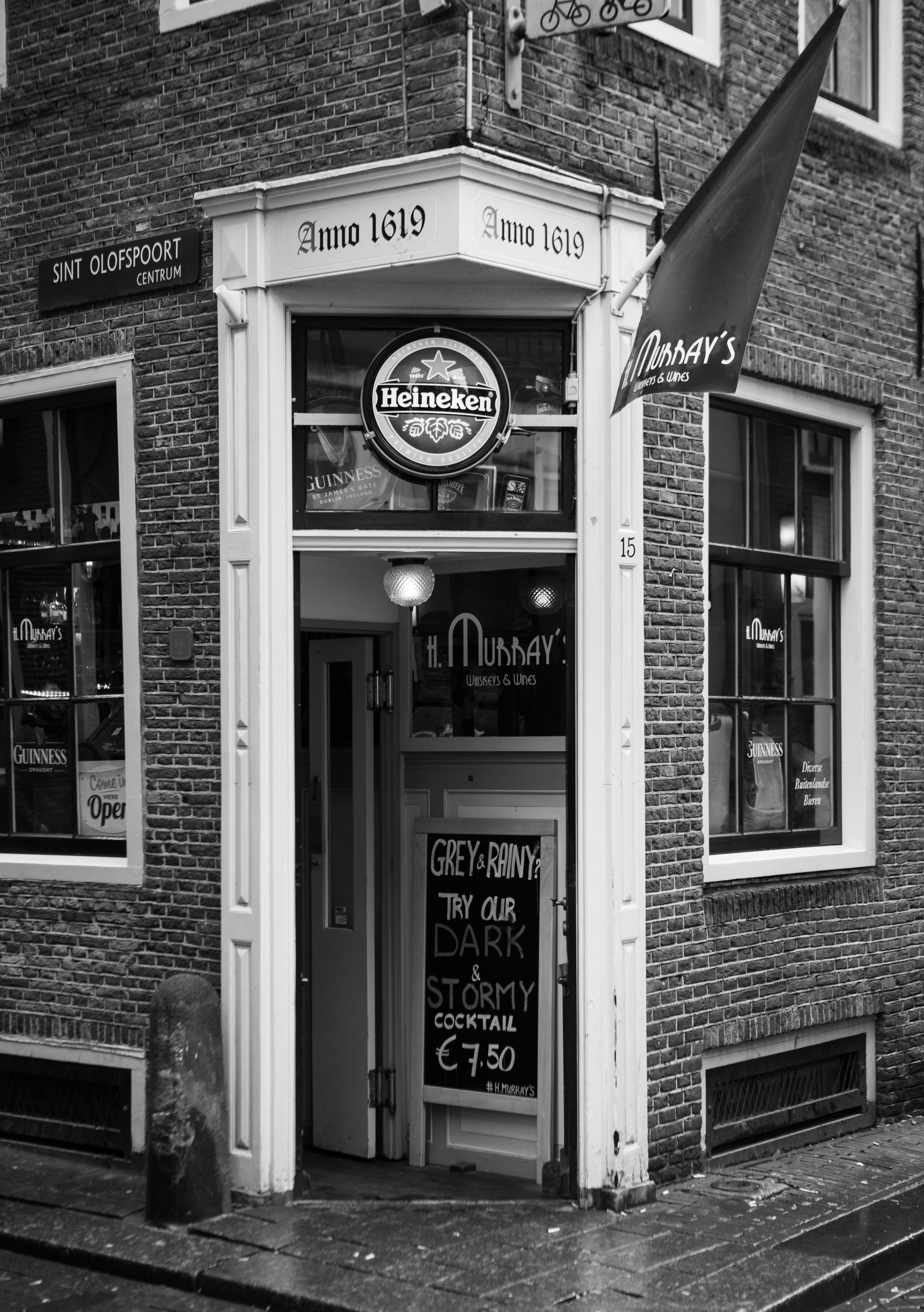 greyscale photography of brick building