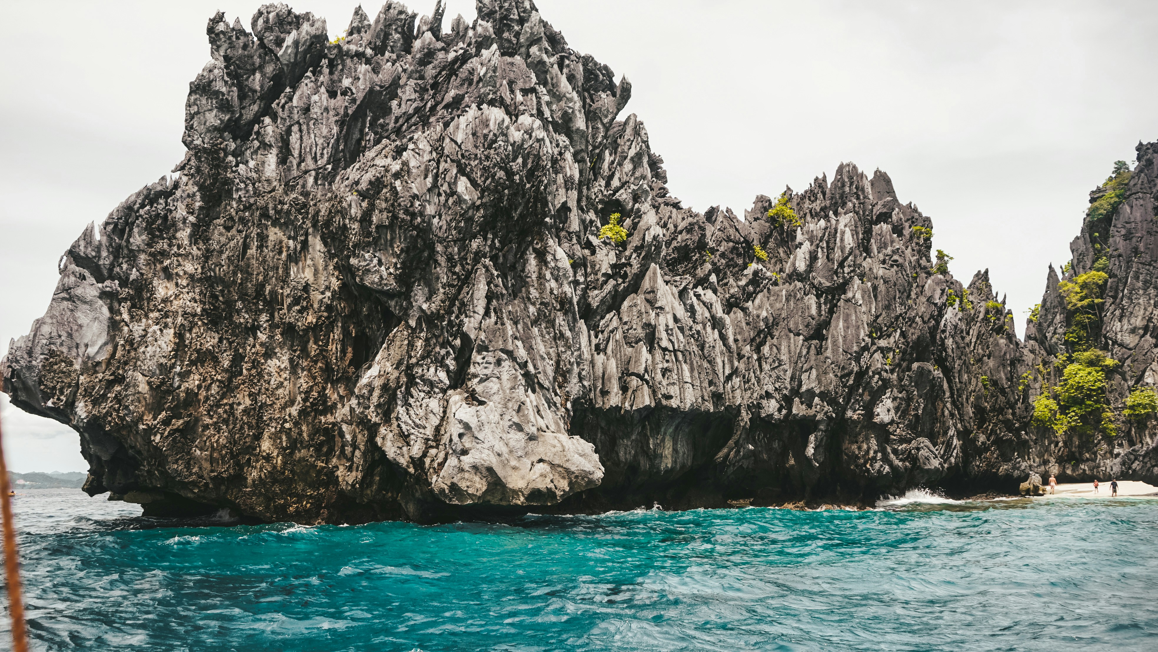 Azure Cliffscape: Turquoise Waters Meet Jagged Islands