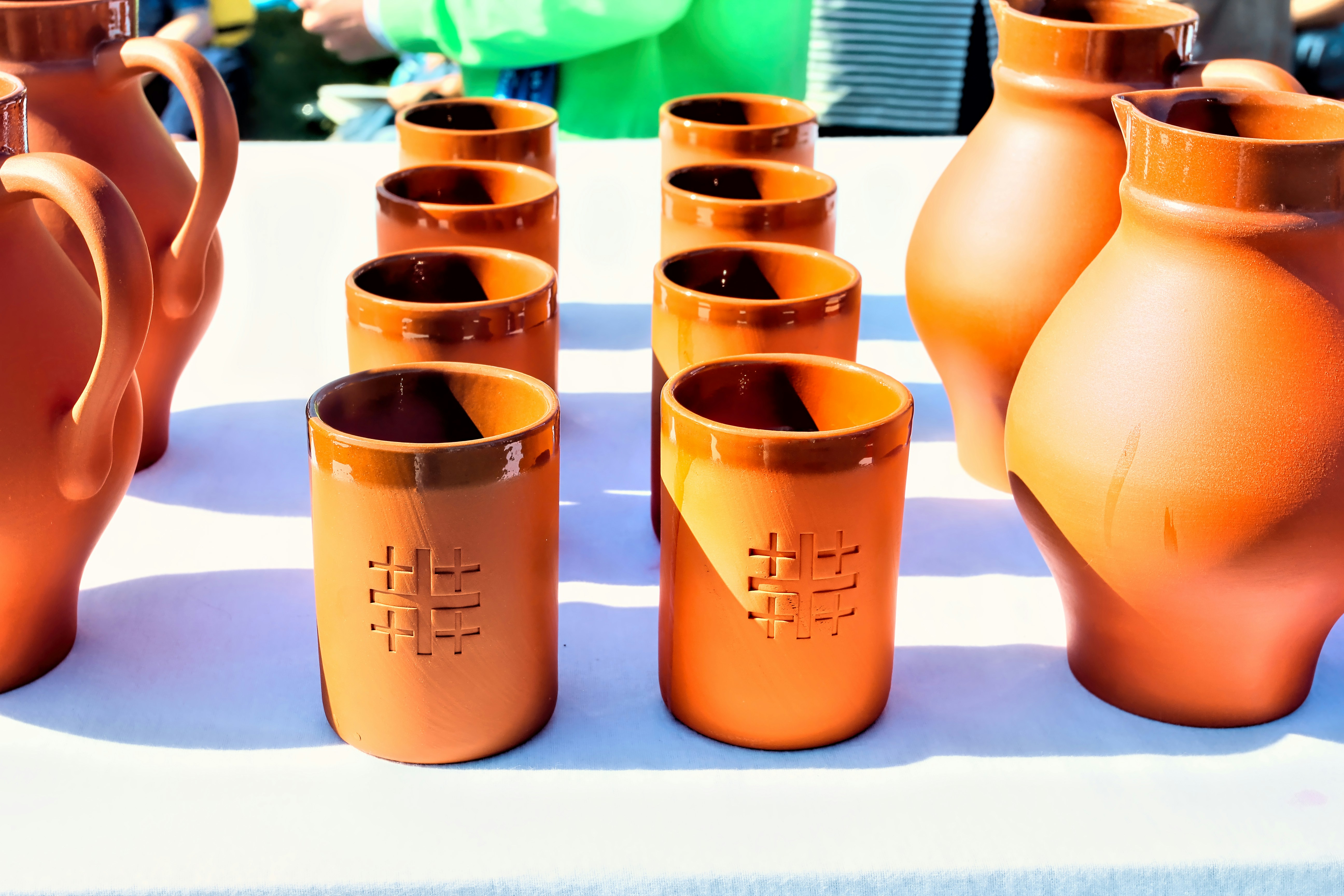 Terracotta Row: Ceramic Mugs on a Bright Table