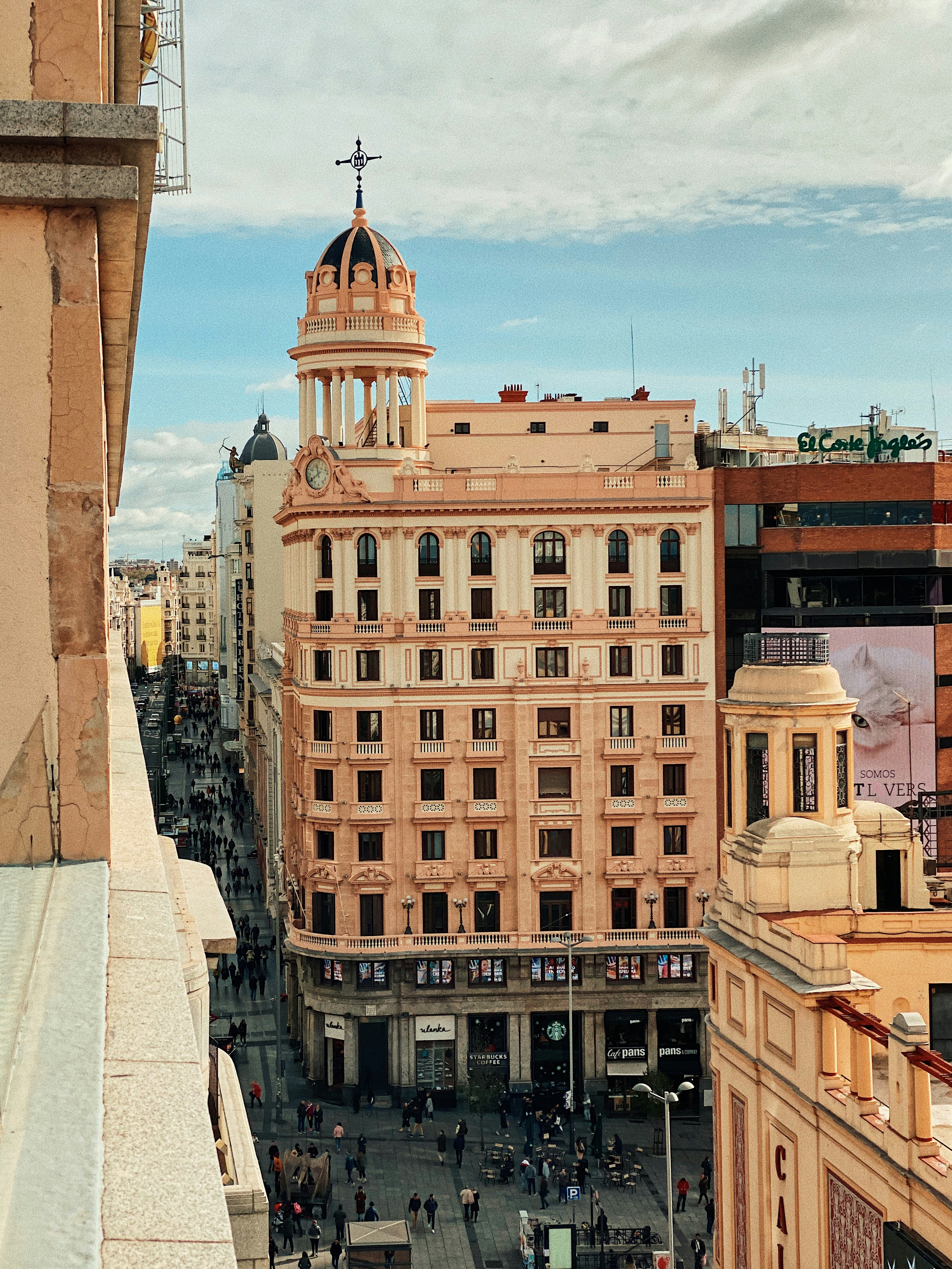 Dome-Topped Facade Over a Lively City Street