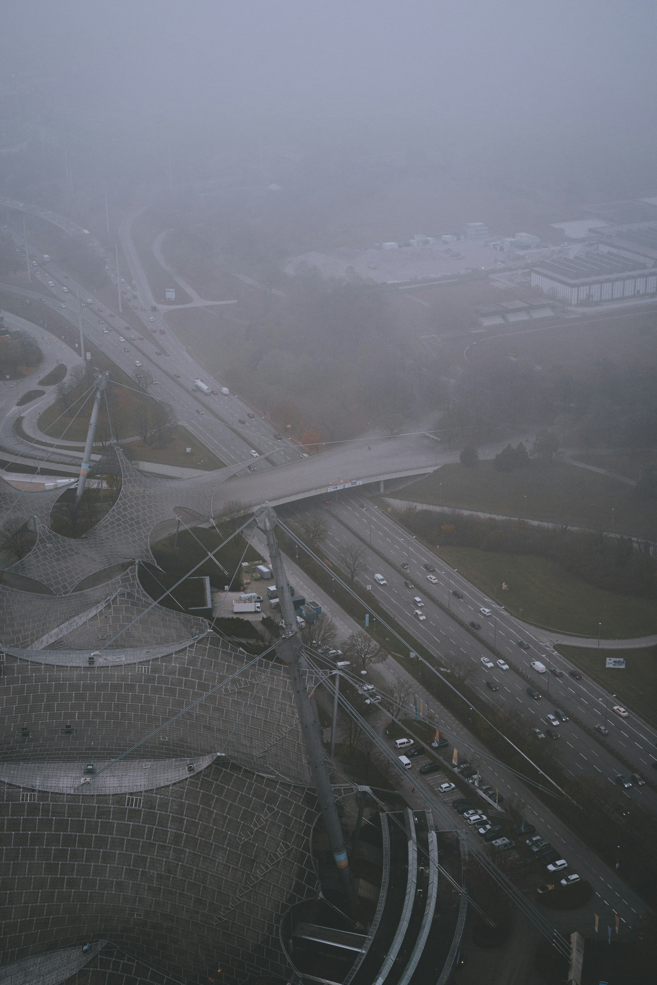 Mist-Threaded Overpass: Aerial Geometry Under Fog