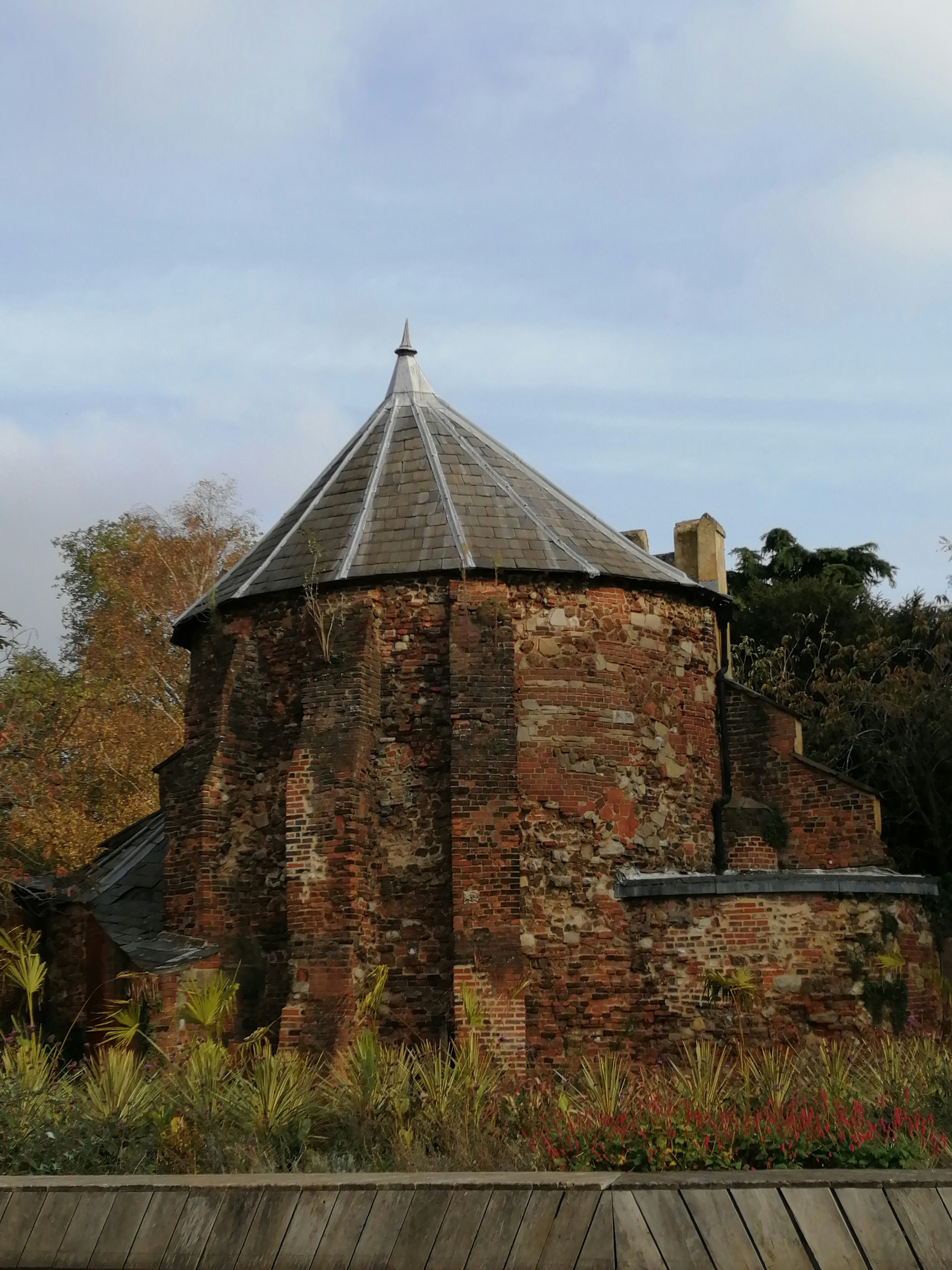 Brown concrete house near trees during daytime photo – Free Building ...