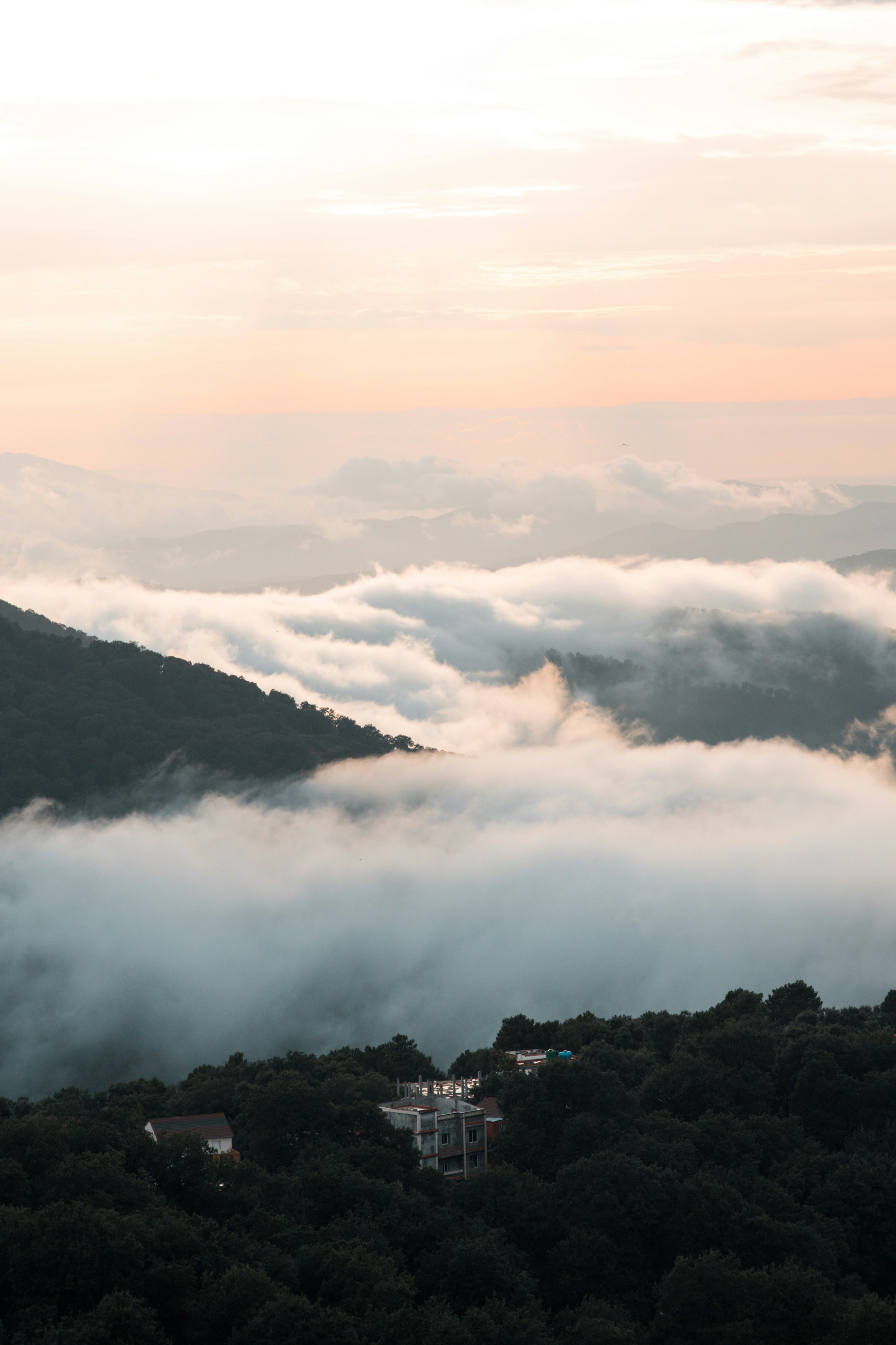 A view of a mountain covered in clouds photo – Free Seraïdi Image on ...