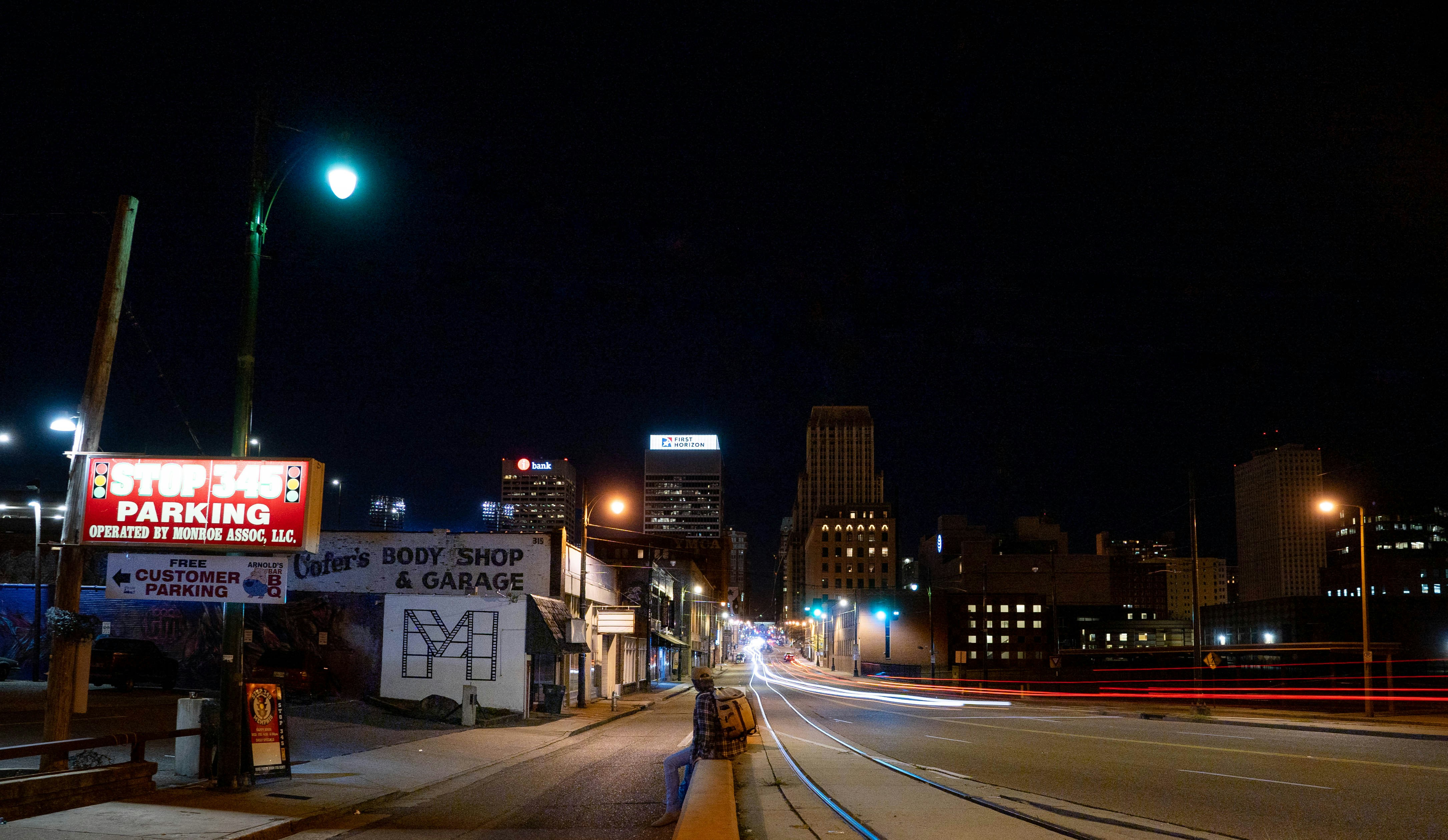 Neon Trails Through the Night Cityscape