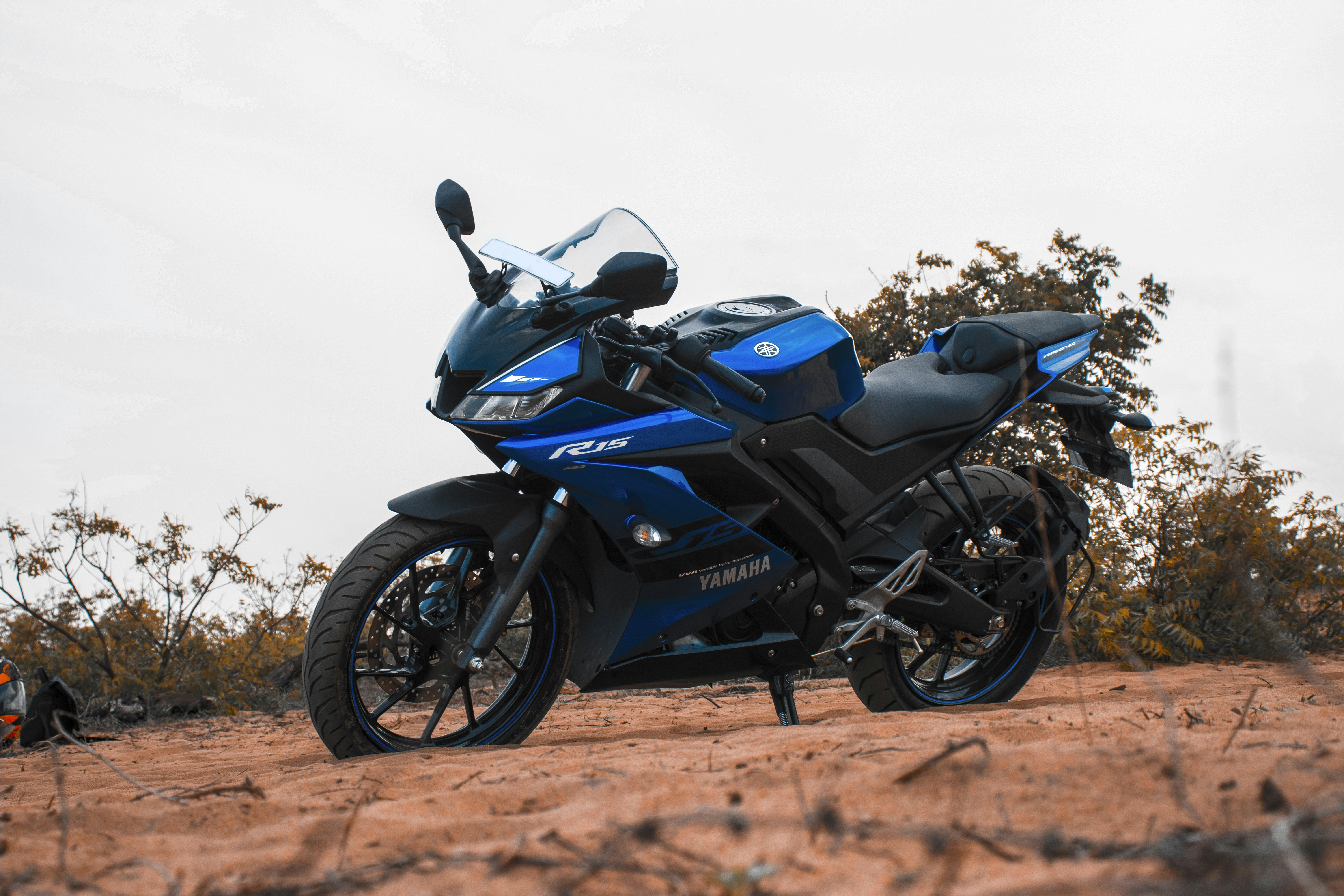 Blue Yamaha on Red Dust: A Desert-Quiet Motorcycle Moment