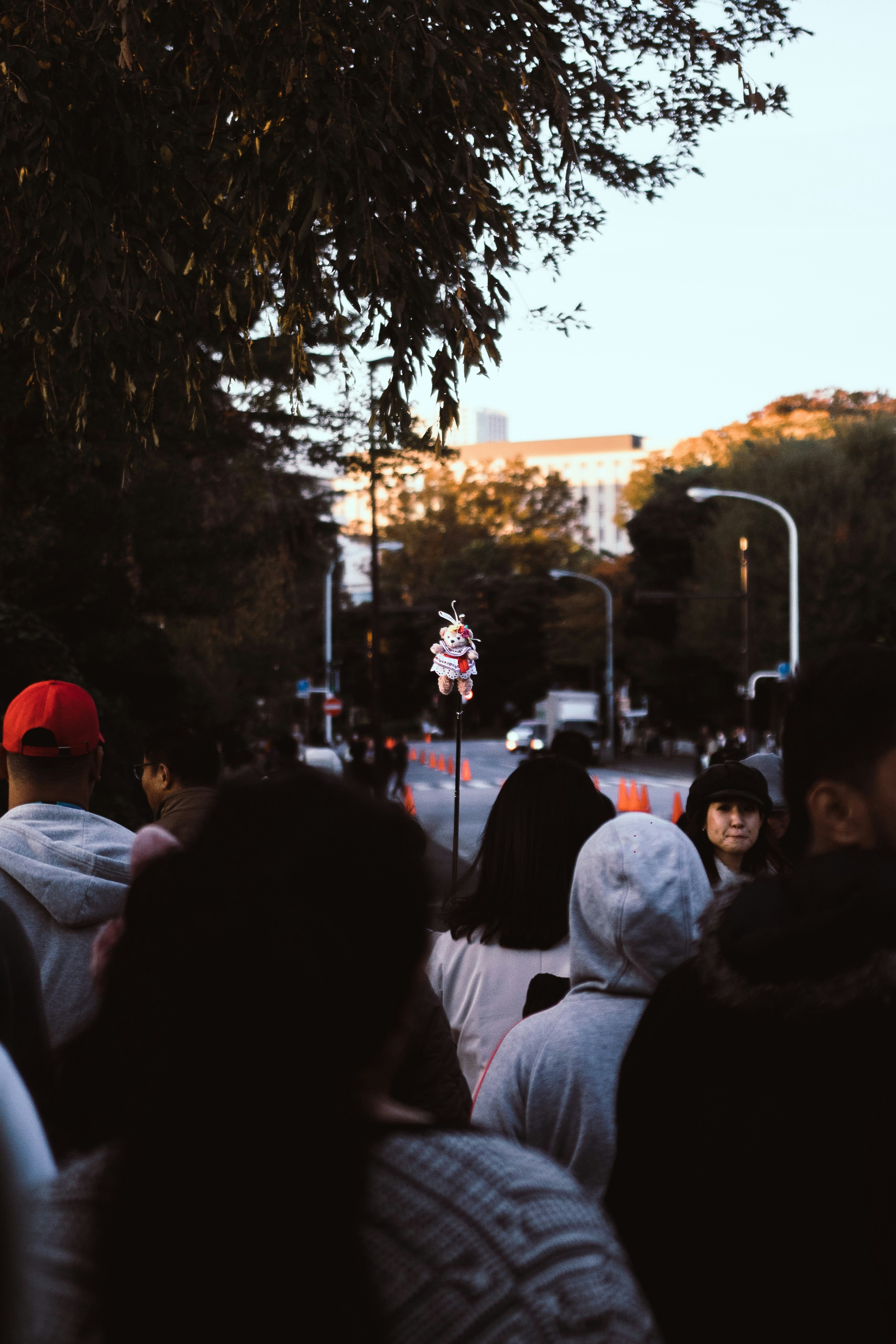 Tiny Unicorn Ornament Hovering Over the Evening Crowd