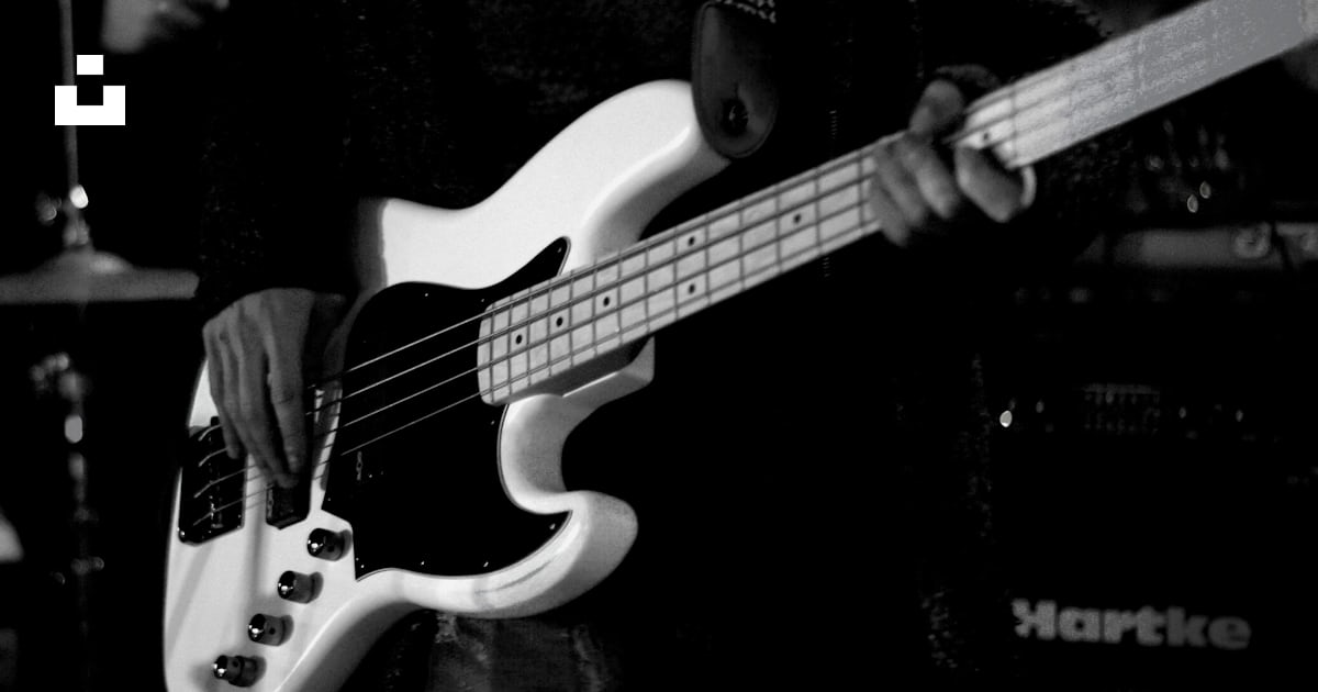 Man Playing Bass Electric Guitar Photo Free Italia Image On Unsplash