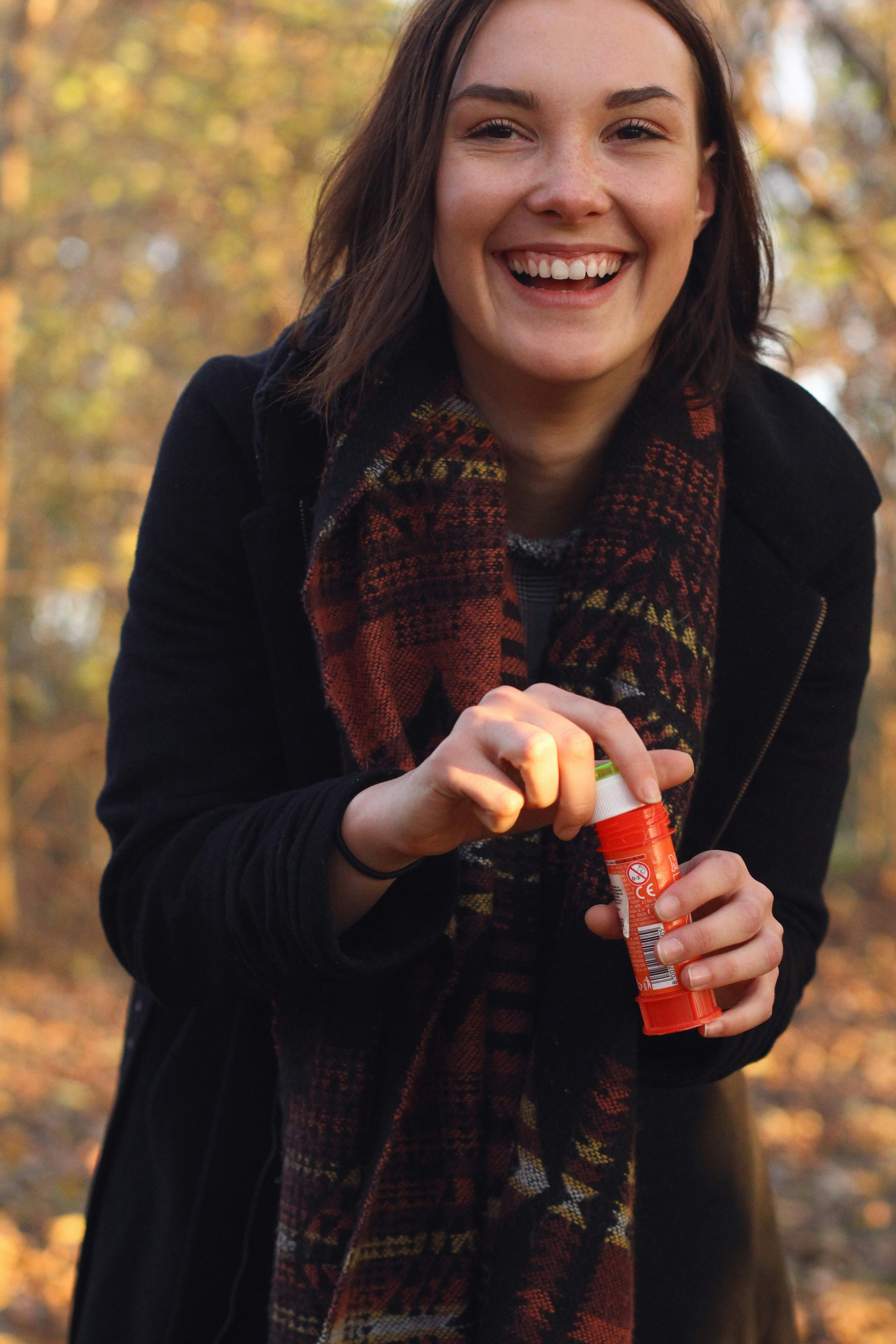 Autumn Light, Genuine Smile: A candid portrait in warm park glow