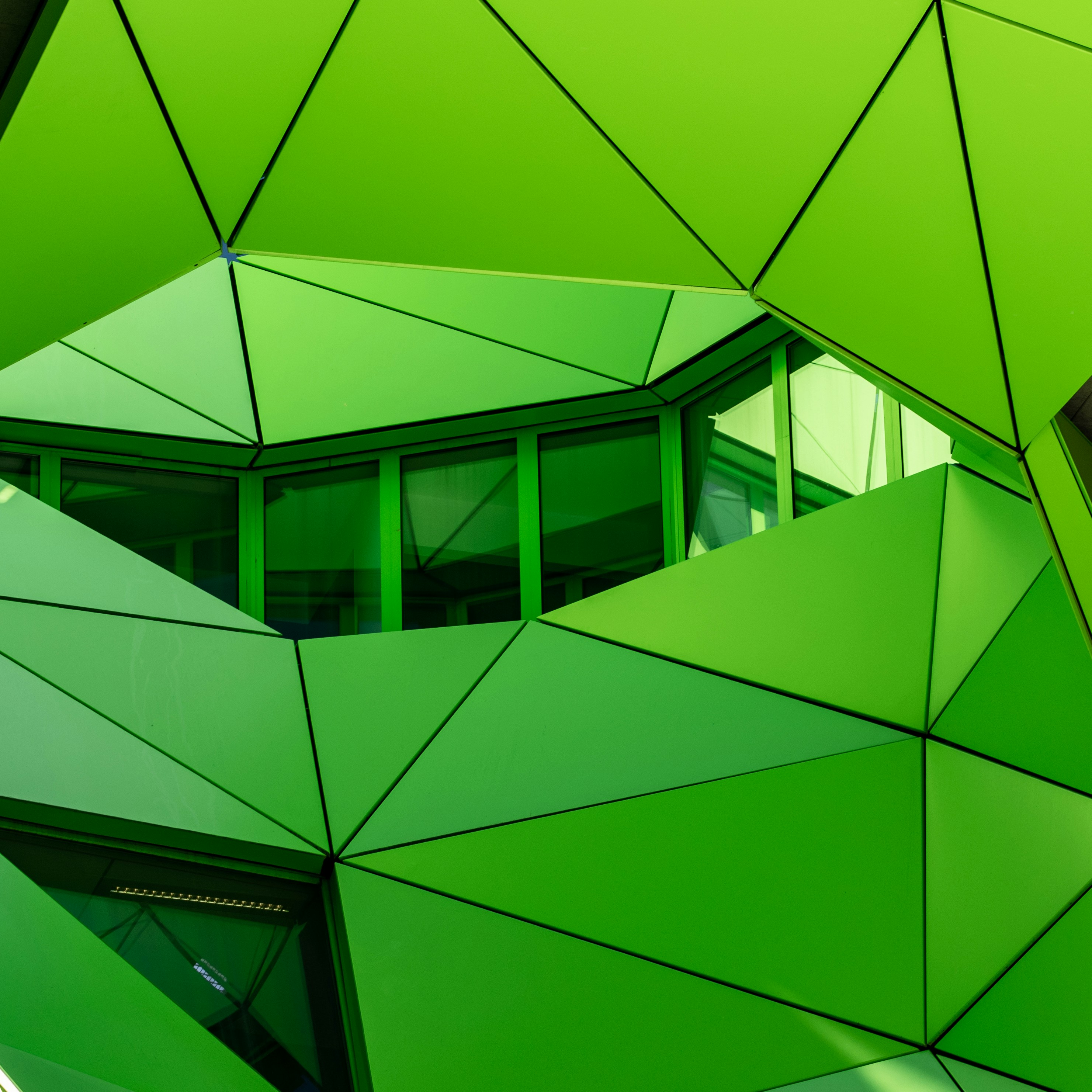 Emerald Facets: A Close-Up on a Geometry-Driven Green Facade