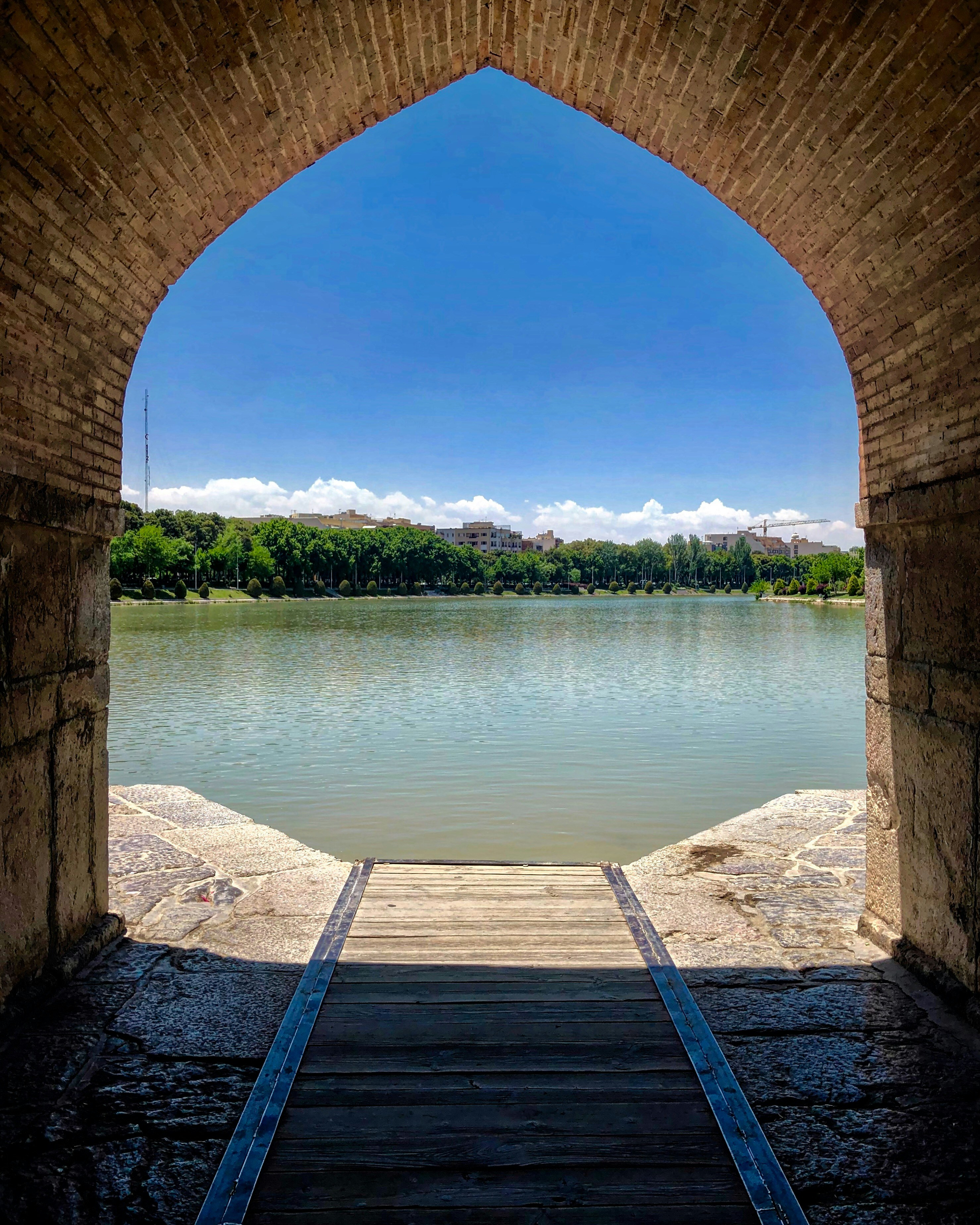 Stone Arch Portal: Docking Toward a Tranquil City Lake