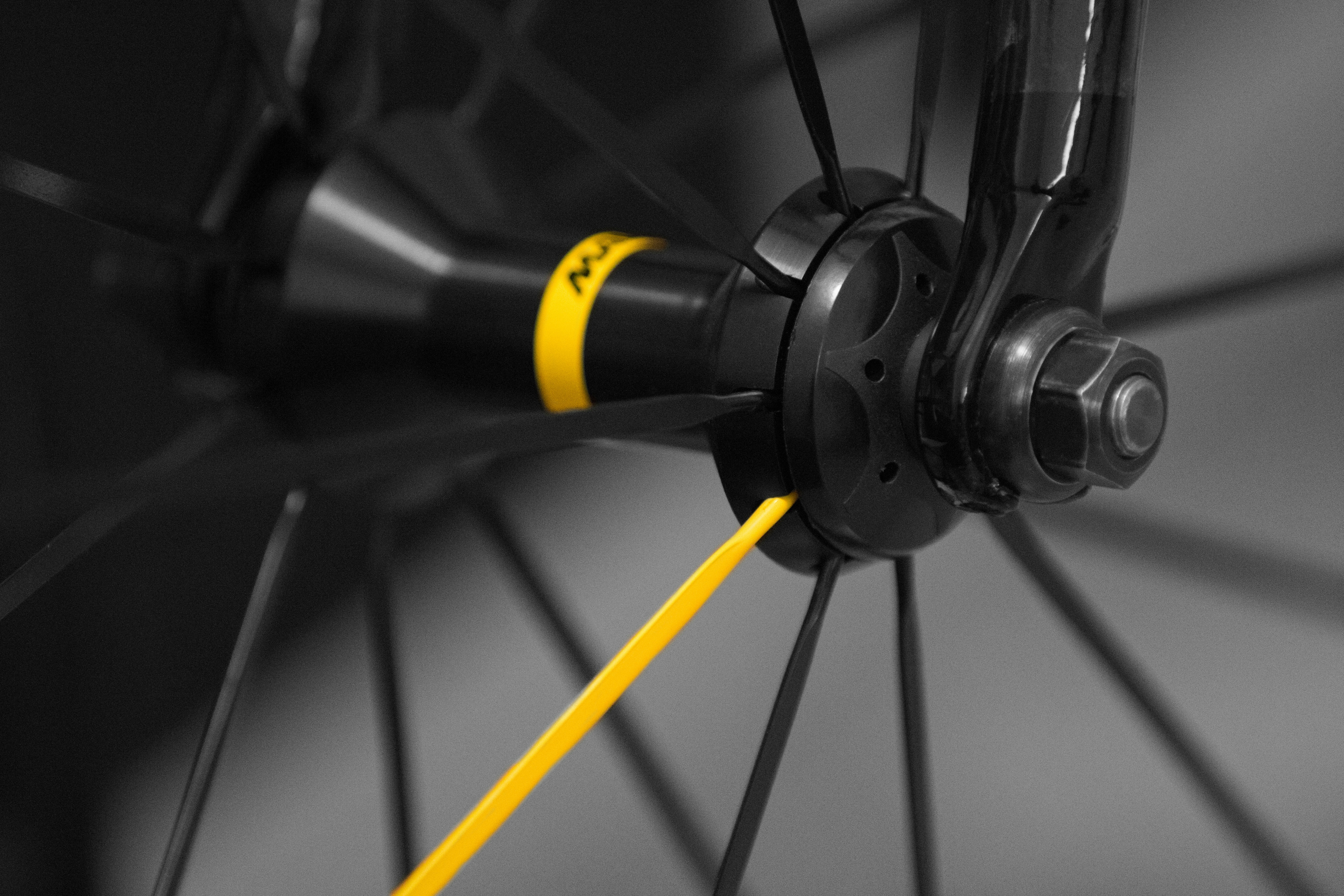 Yellow Thread in the Wheel: Macro Portrait of a Bicycle Hub